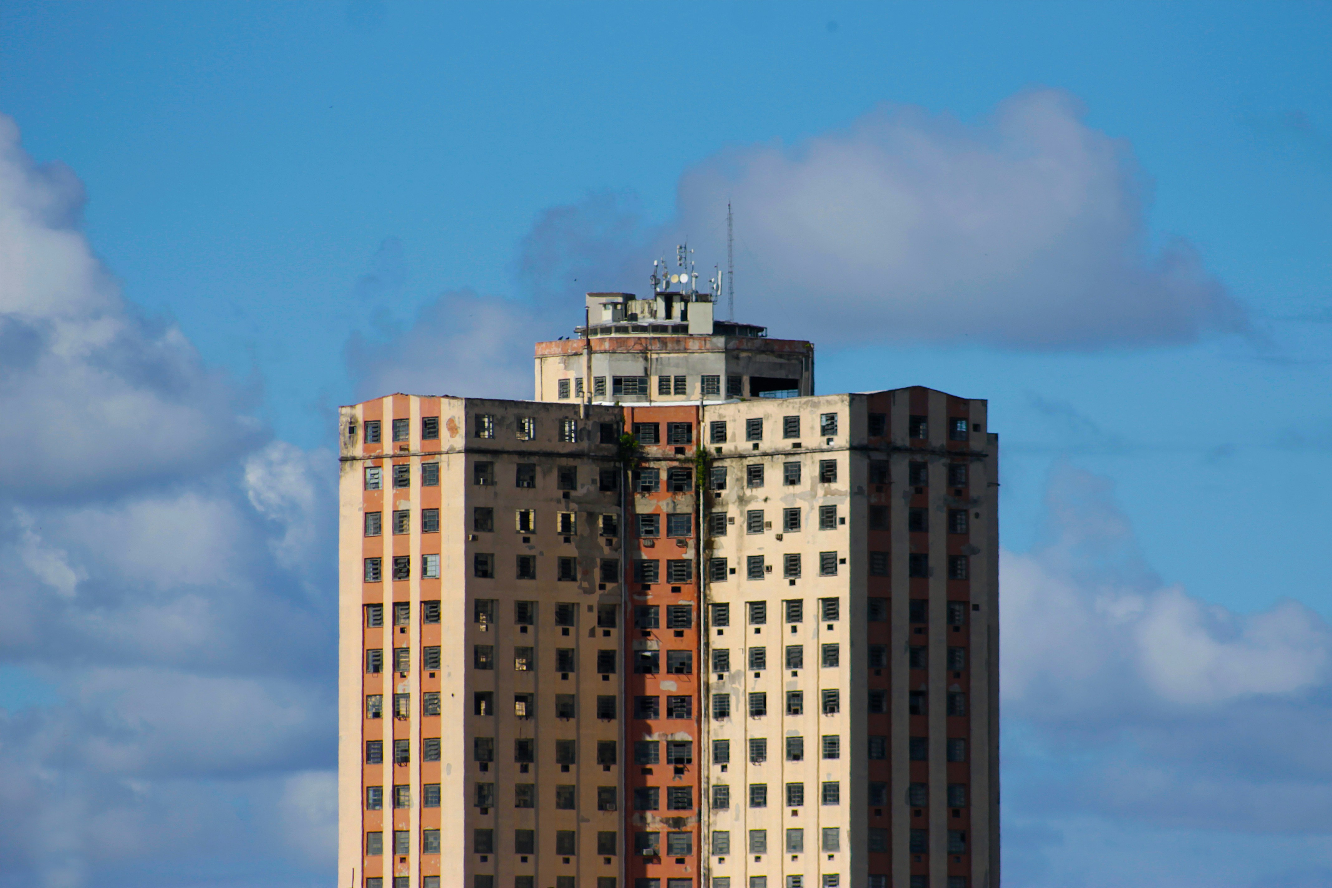 Urban Monolith: Twin-Tower Facade Rising Under a Crisp Blue Sky