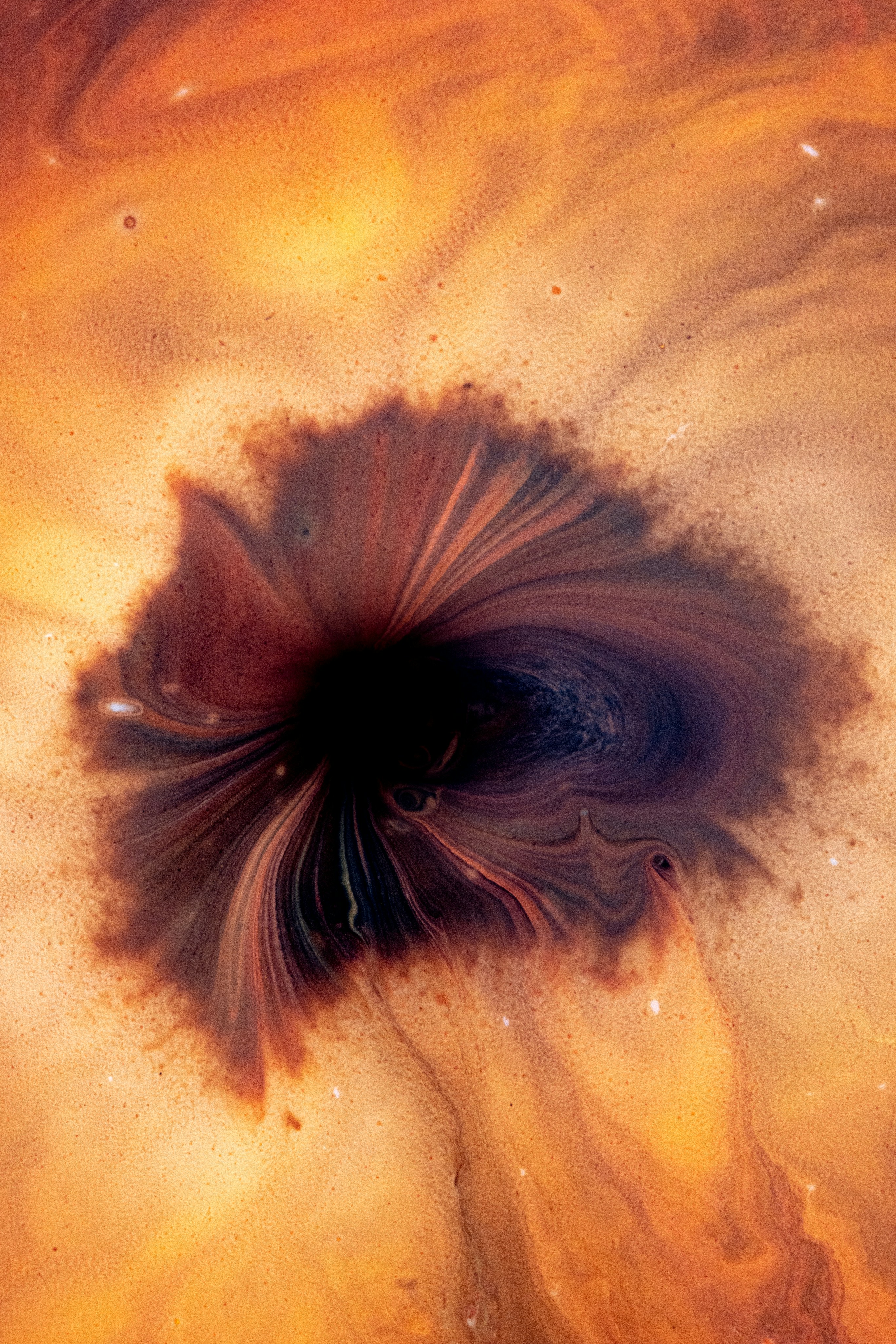Sunburst Vortex: Centered Orange-Black Fluid Spiral