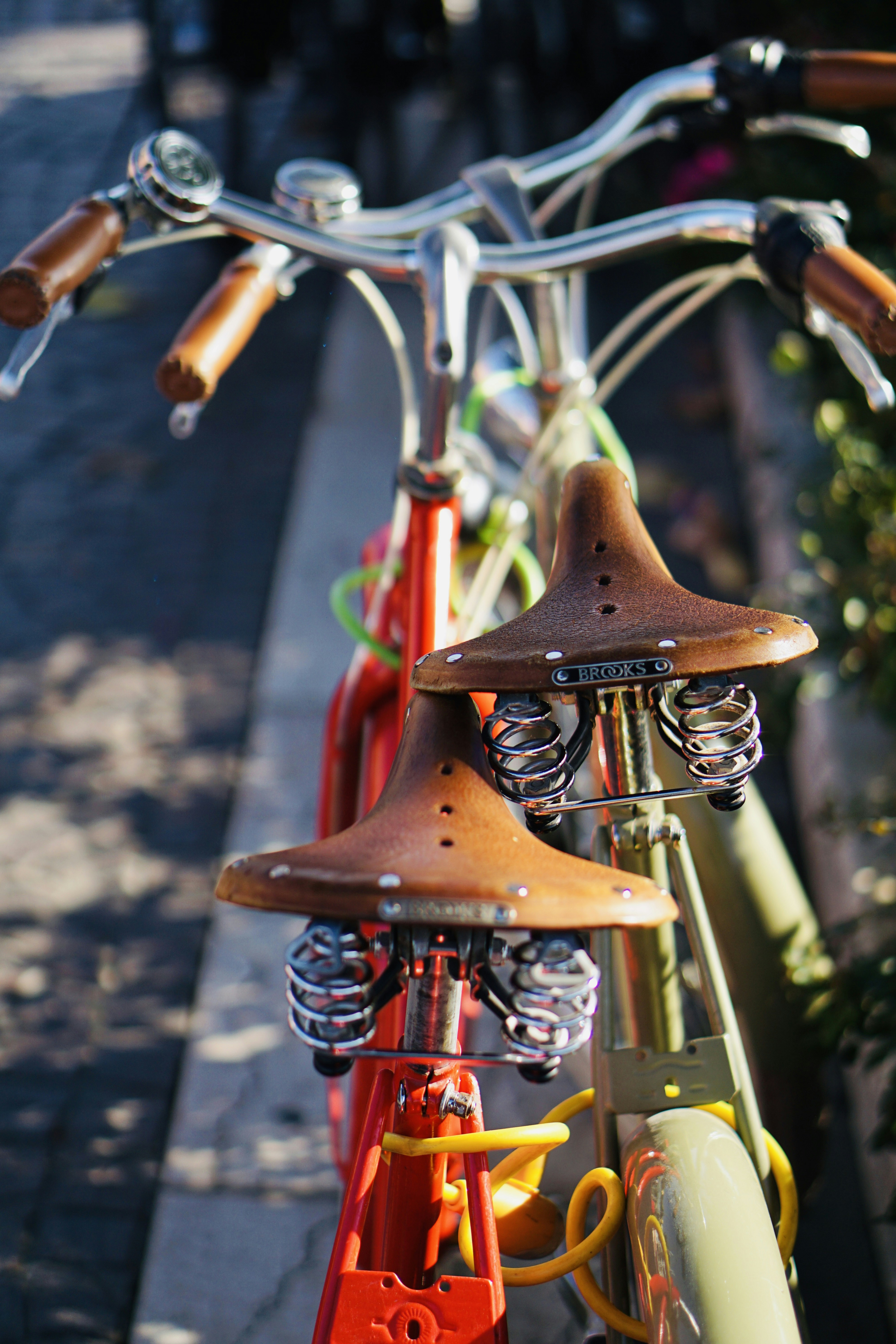 orange and blue bicycle with red and blue bell