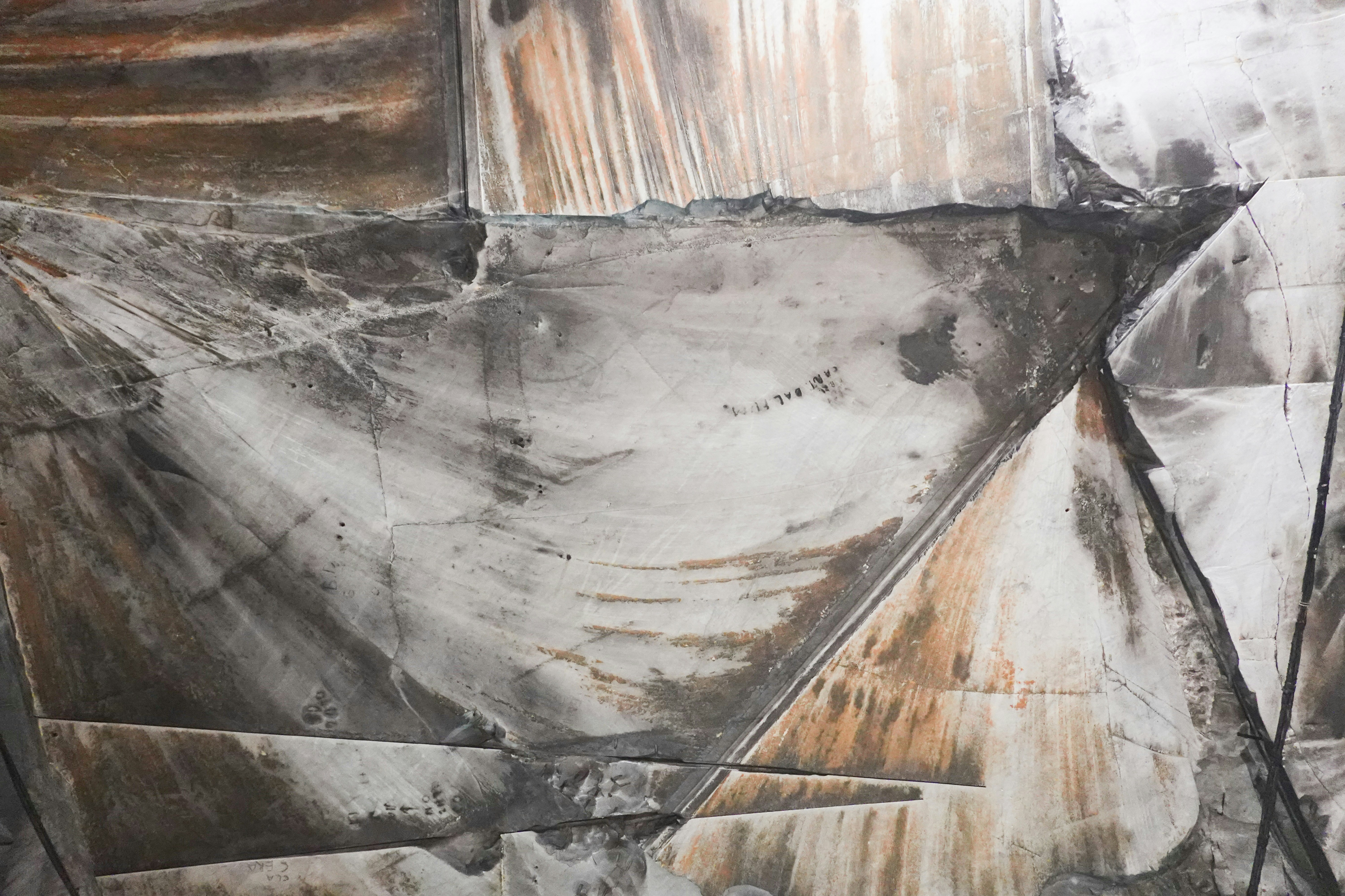 Abstract patterns in Carrara marble showcasing natural veining and textures.