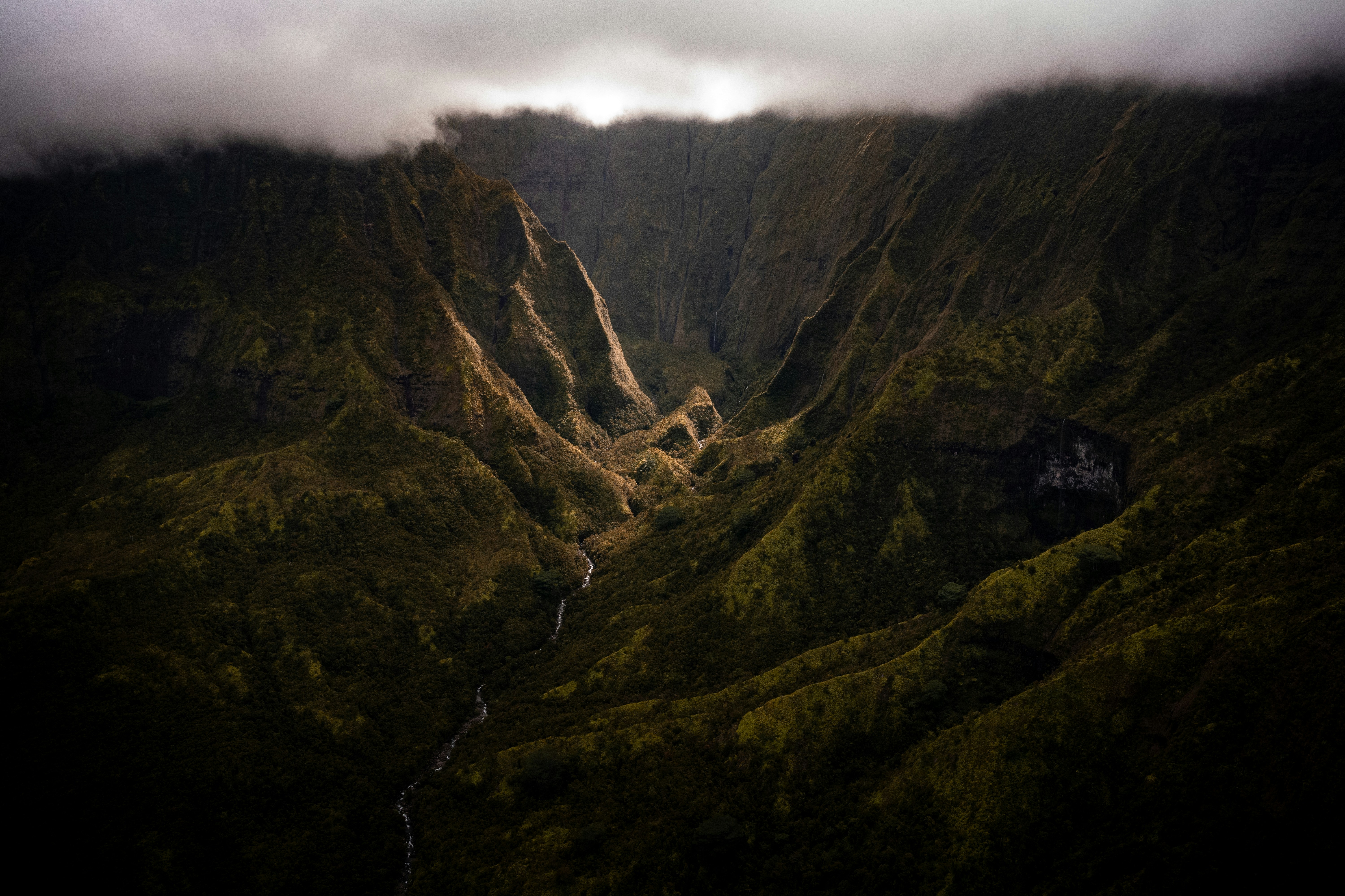 Mystical Valley Under Cloudy Skies