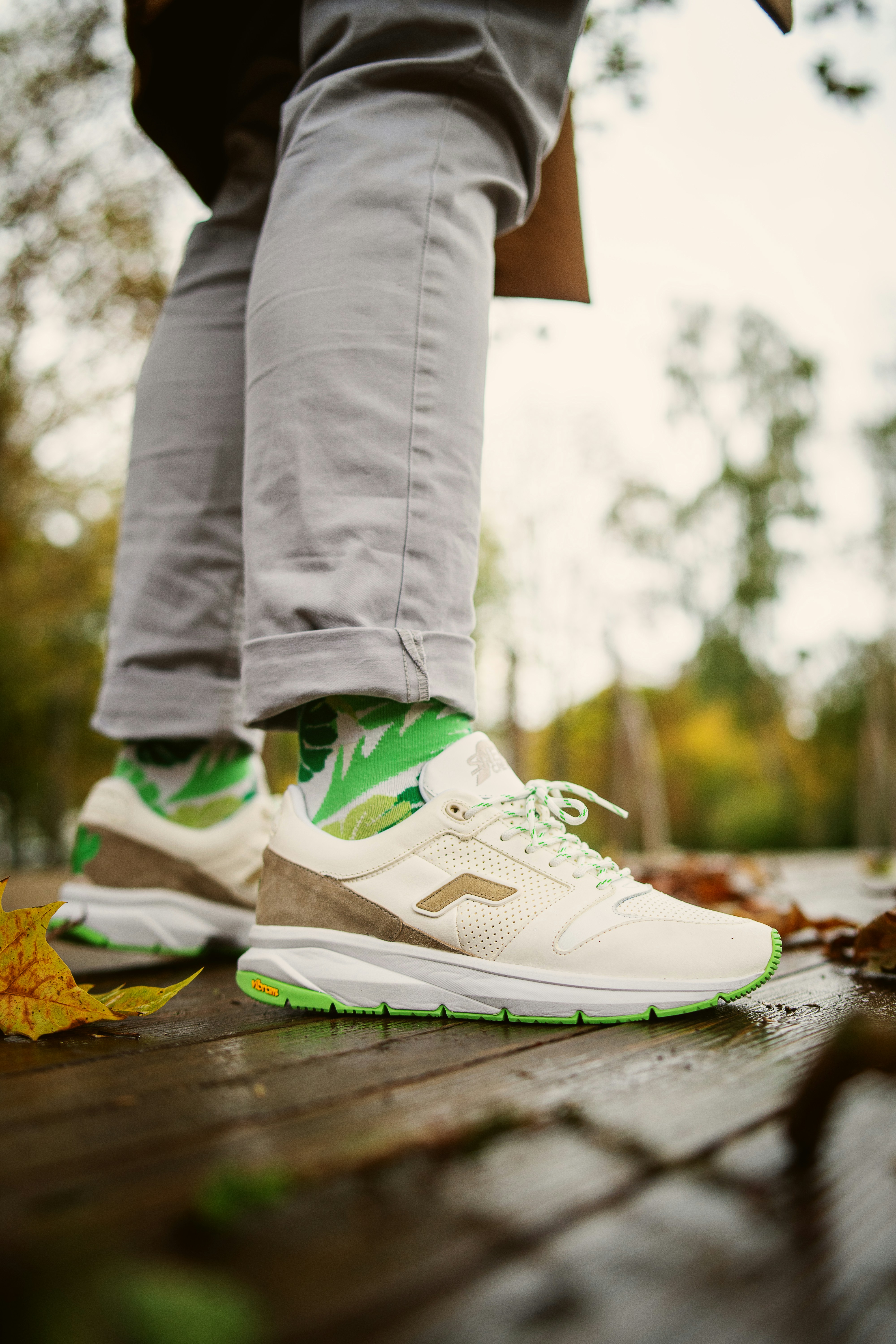 Sneaker Summit: Neon-soled Shoes Grounded in Autumn Leaves