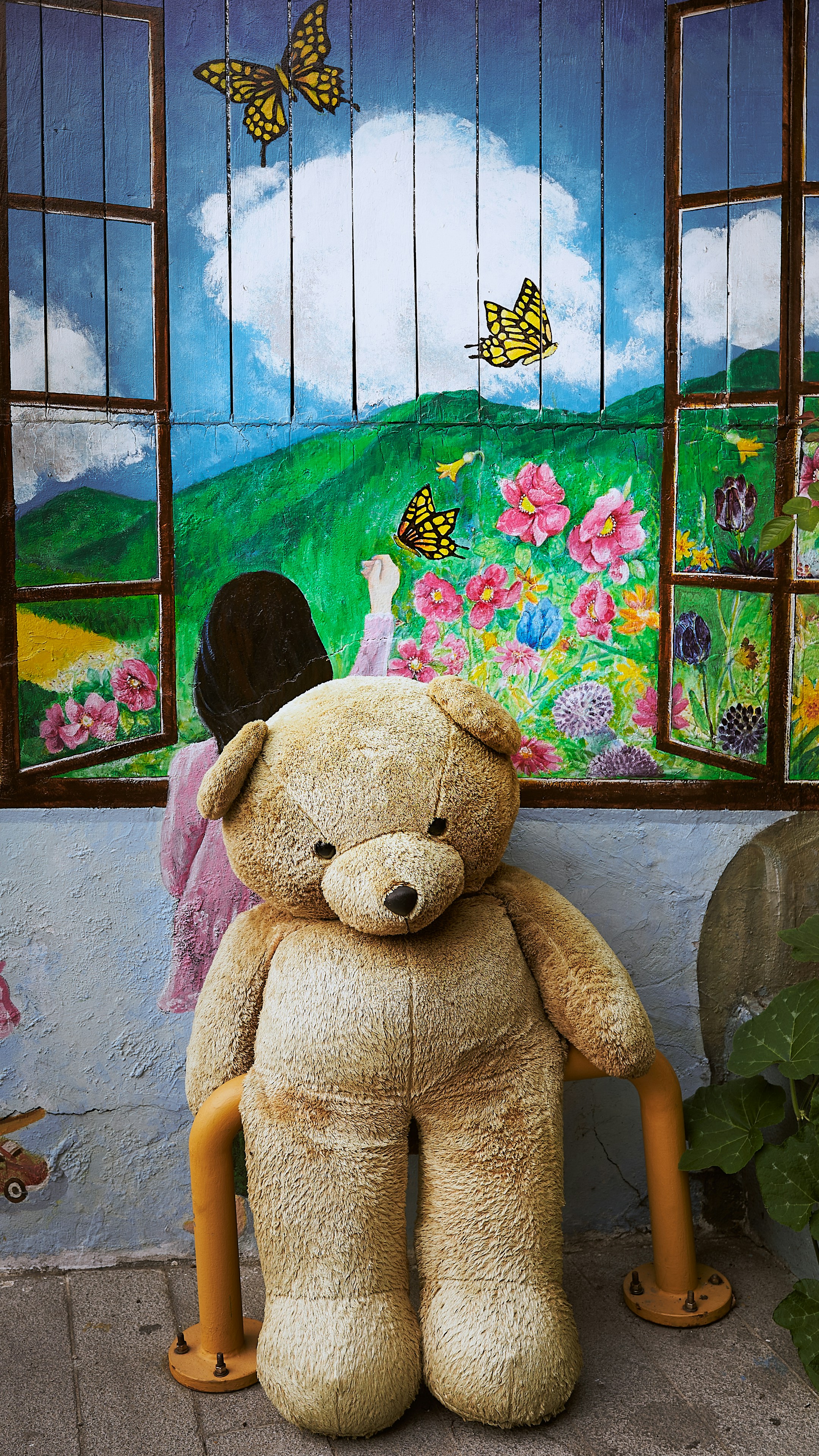 Plush Guardian Before a Painted Garden Window