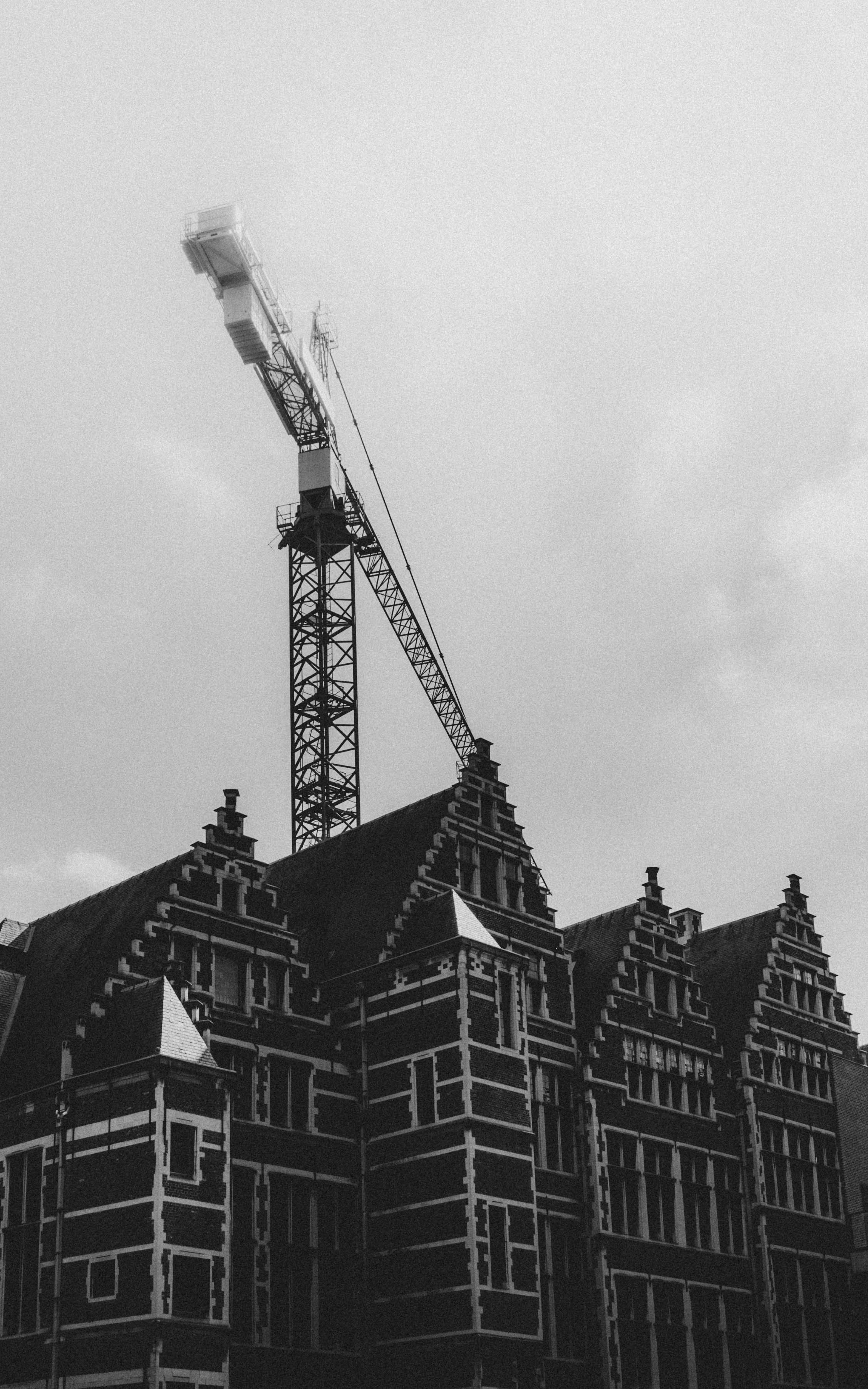Crane Watch over Historic Façade