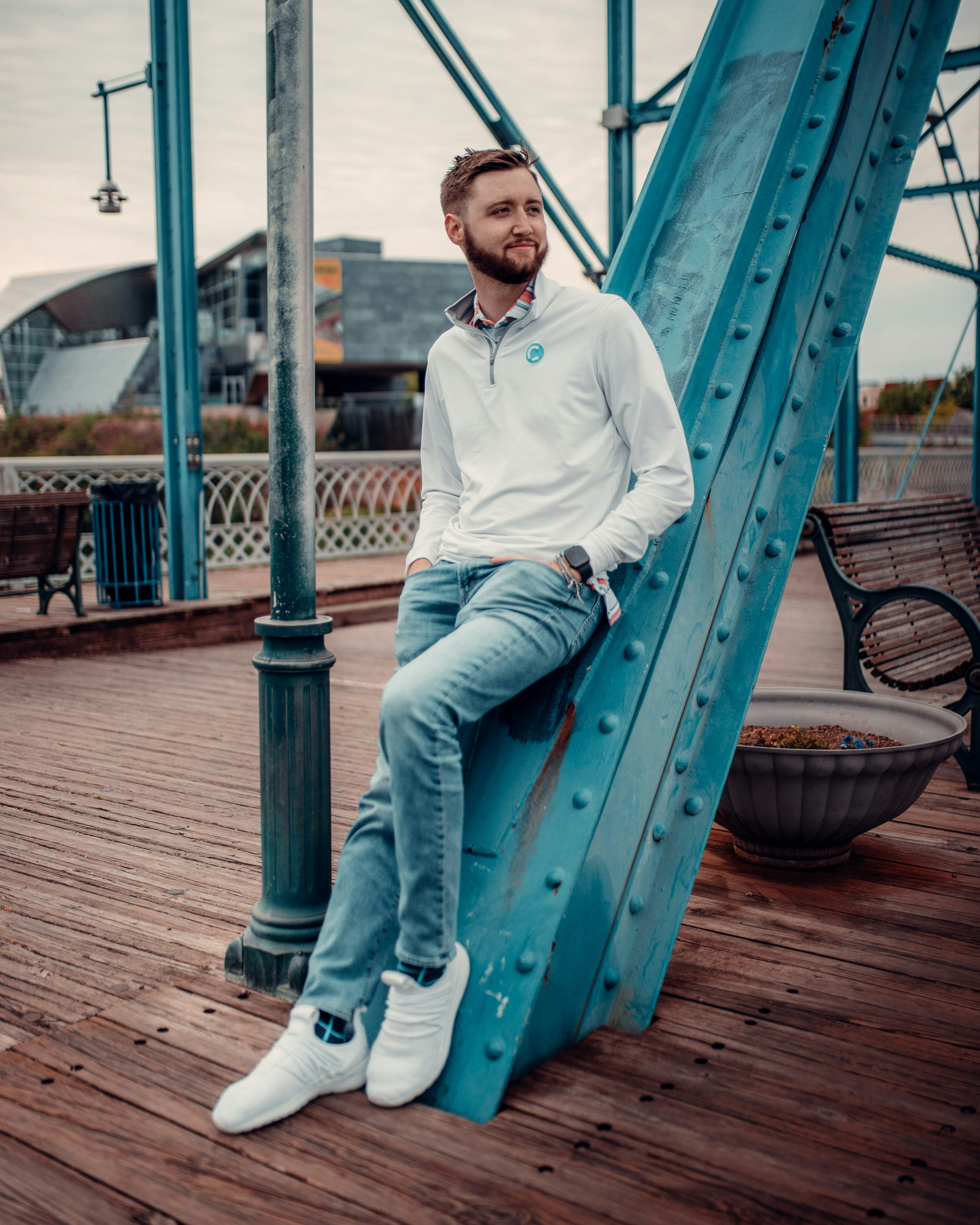 Leaned Against the Blue Arc: Casual Contemplation on the Pier