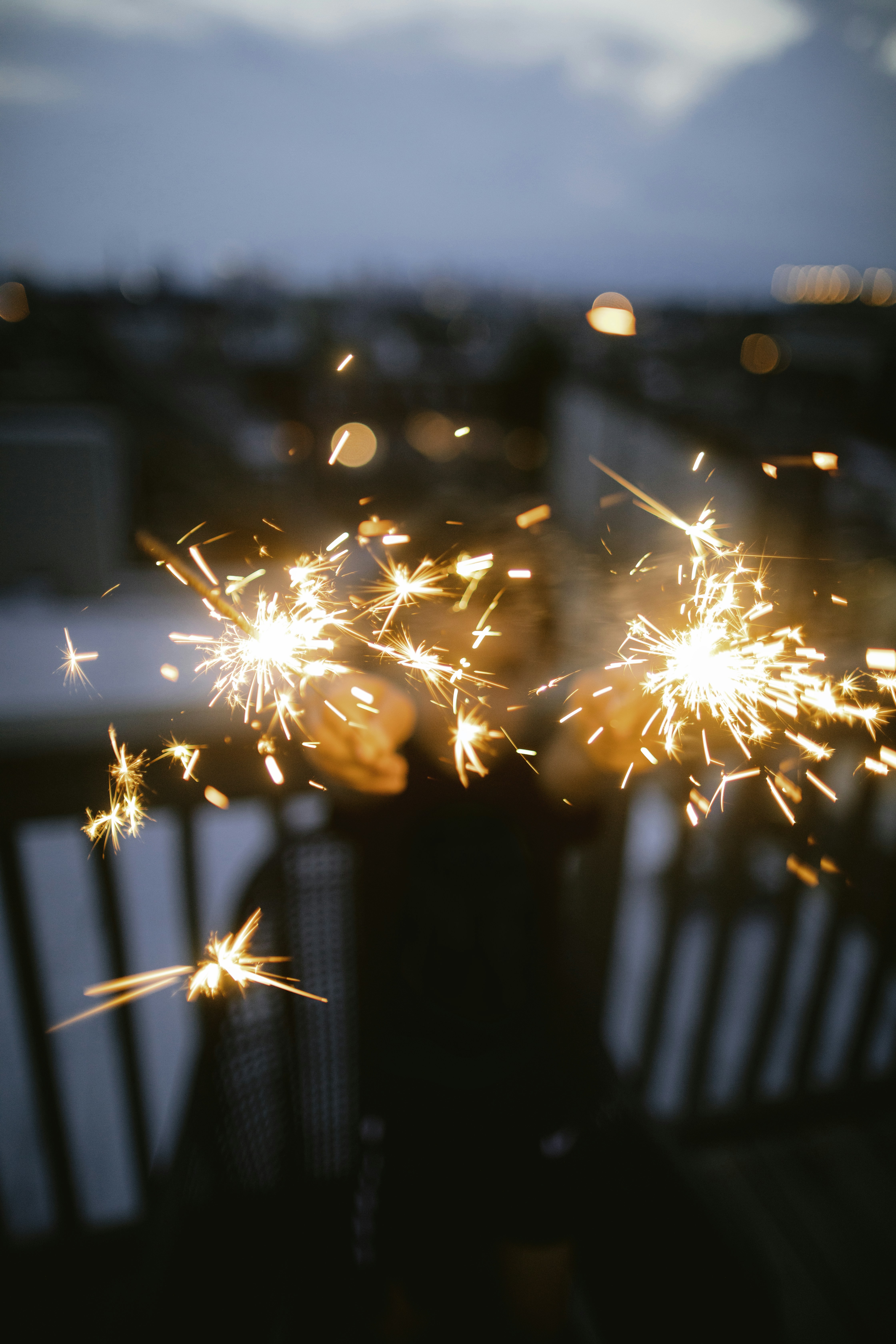 Sparks on a Rooftop Night: Firework Wishes Across the City