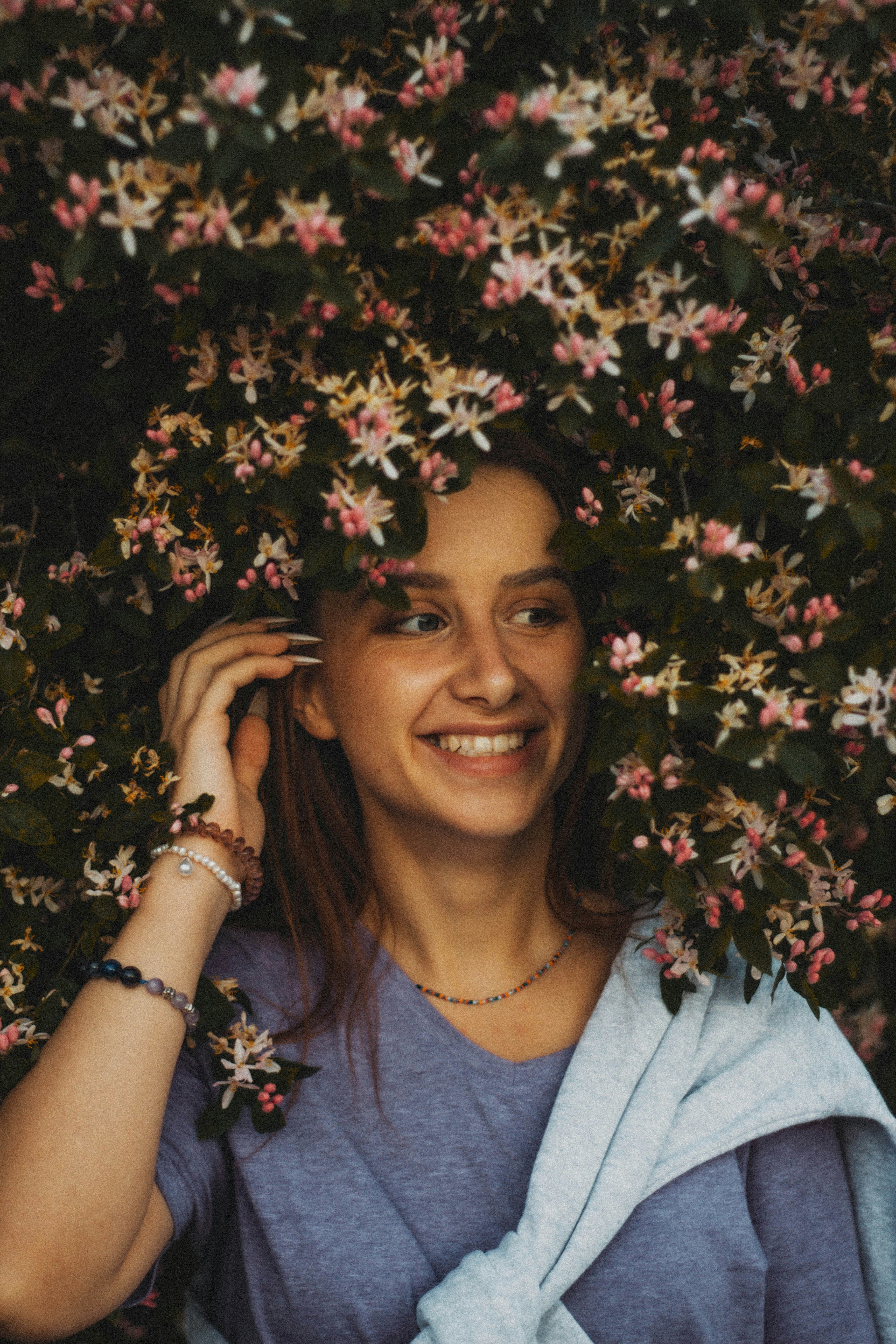 woman in gray crew neck shirt smiling