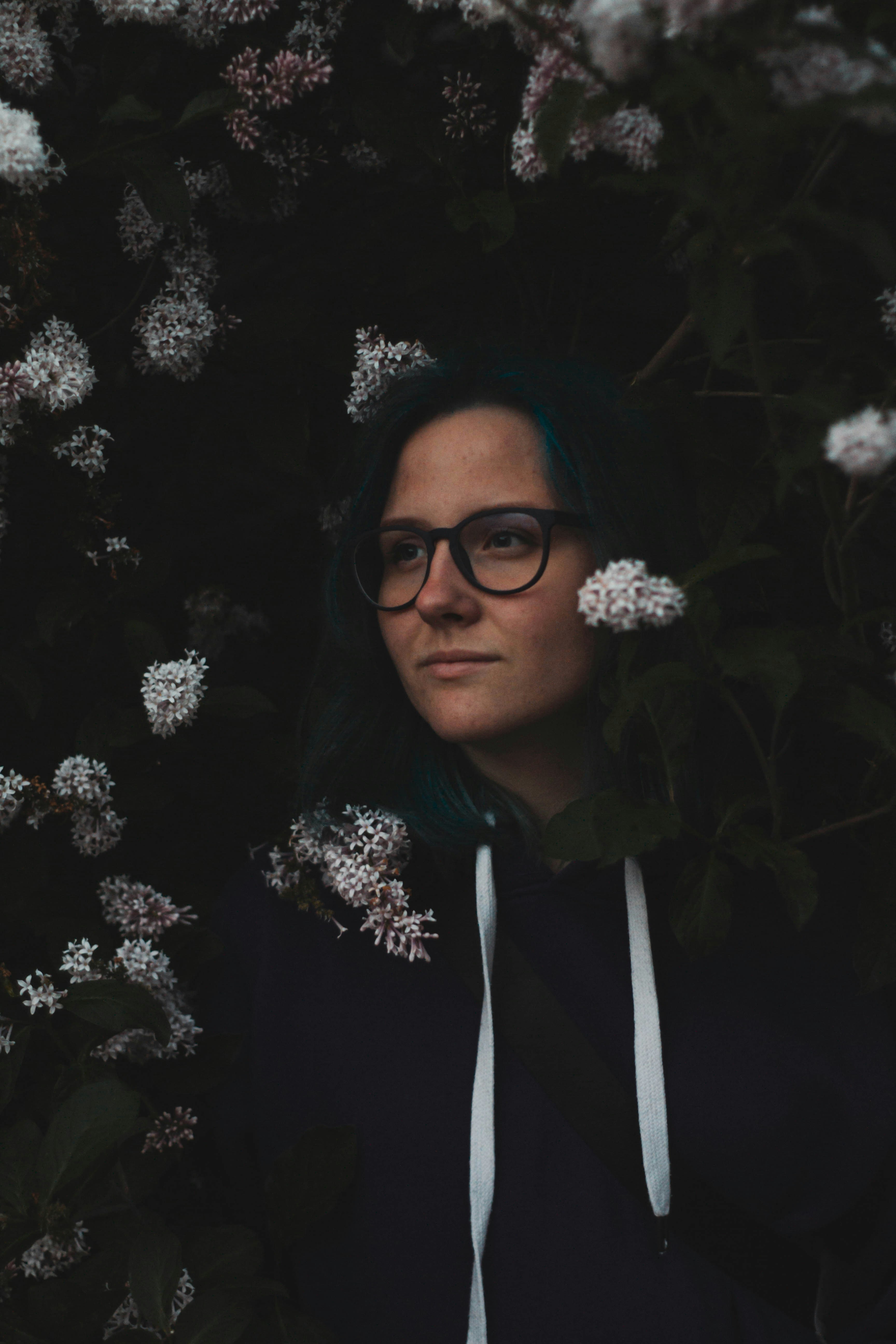 Midnight Lilac Portrait: Quiet Confidence Amid Fragrant Shadows