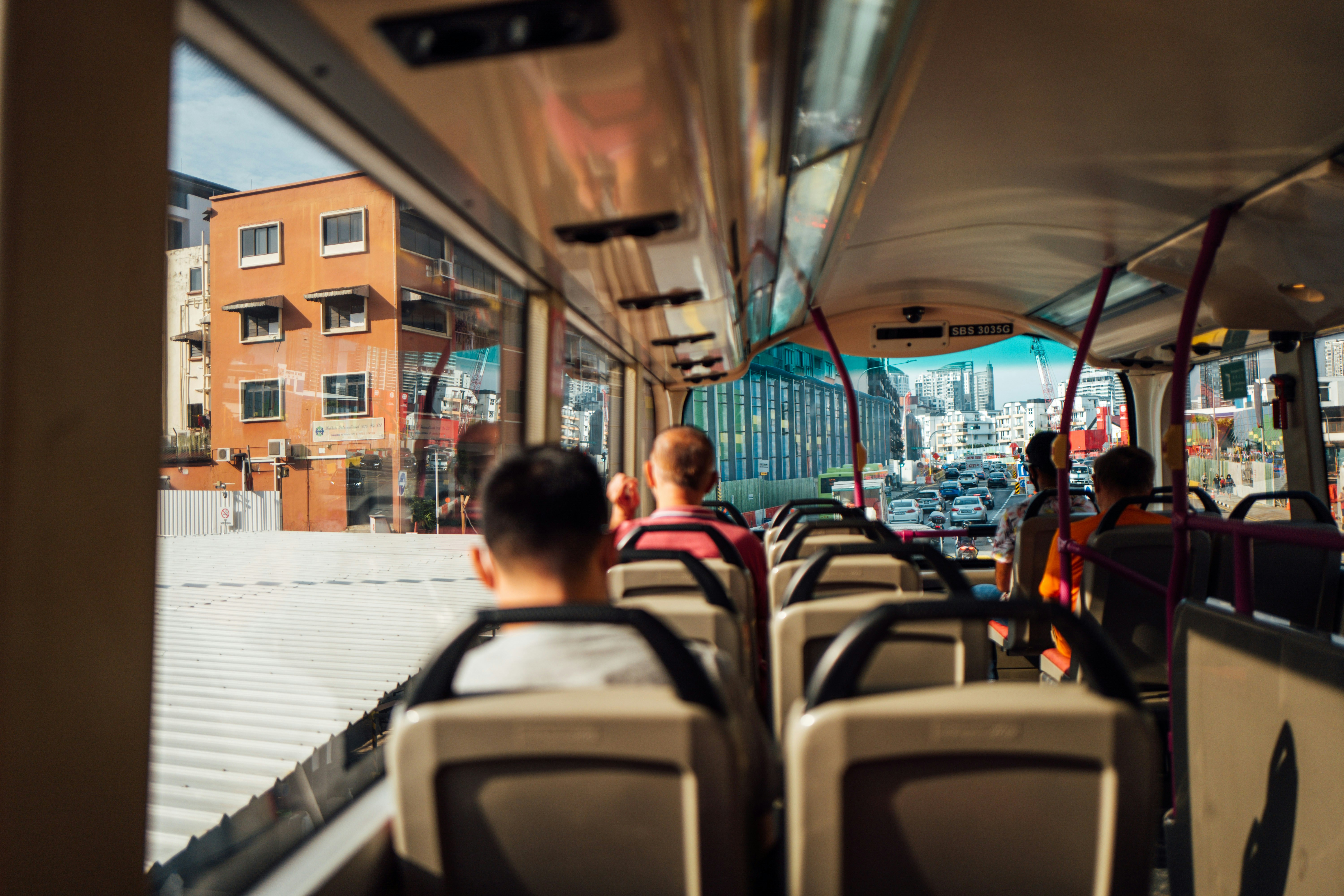 People sitting on bus seats photo – Free City Image on Unsplash