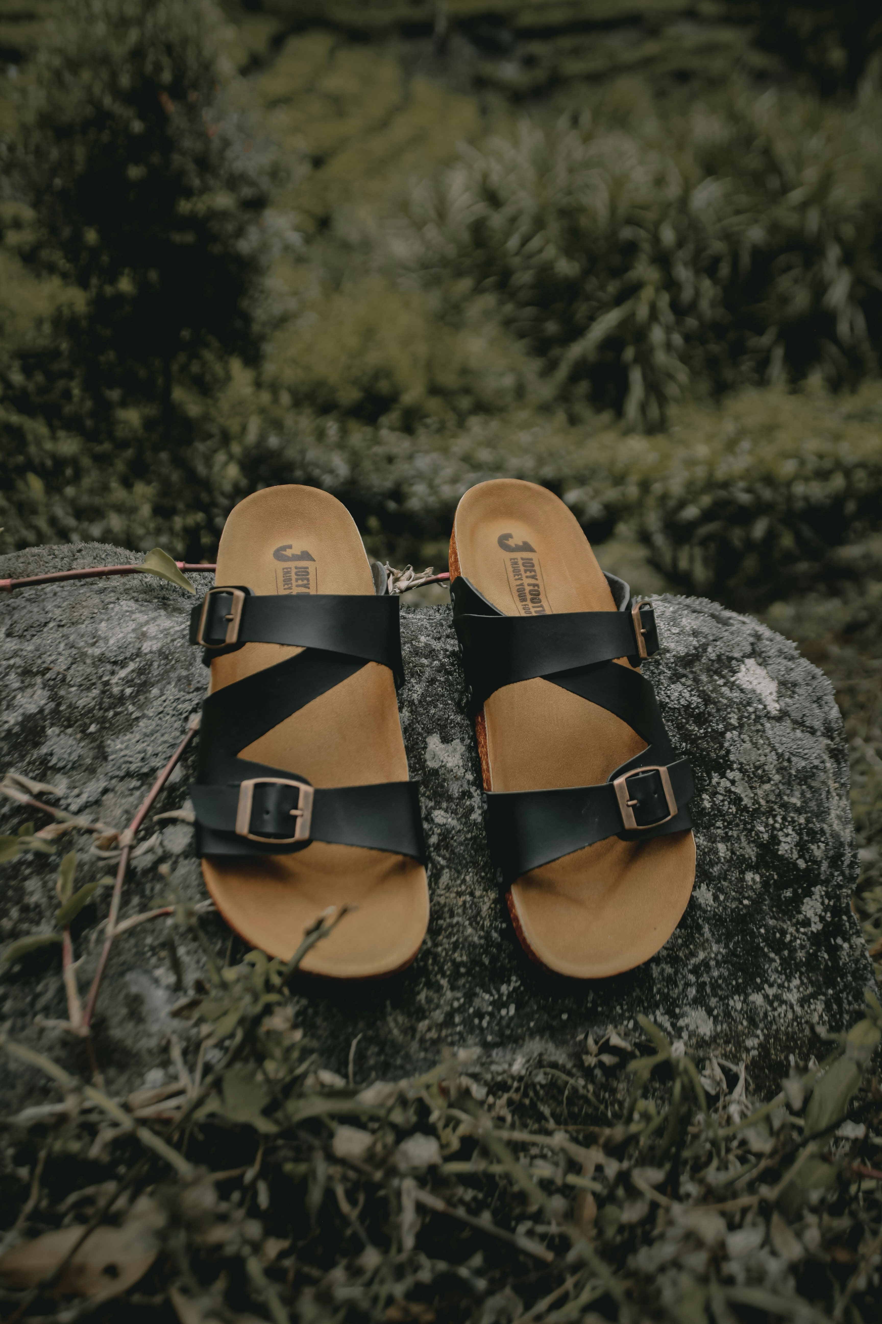 Brown and black flip flops on gray rock photo – Free Product ...