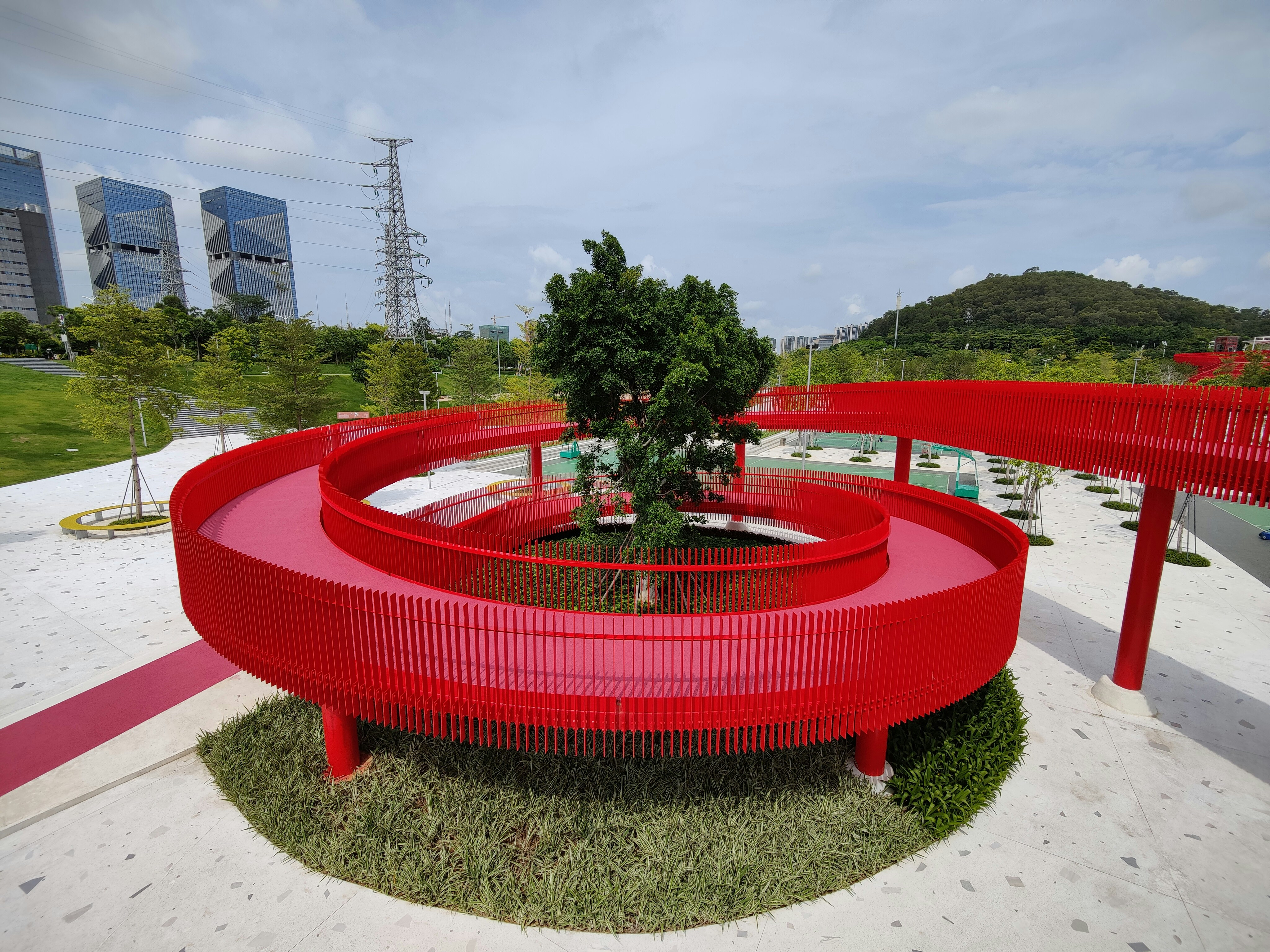 This is part of Hongqiao(or "虹桥" in Chinese), an air walkway which holds a length of about 4,000 meters. | red round outdoor fountain during daytime
