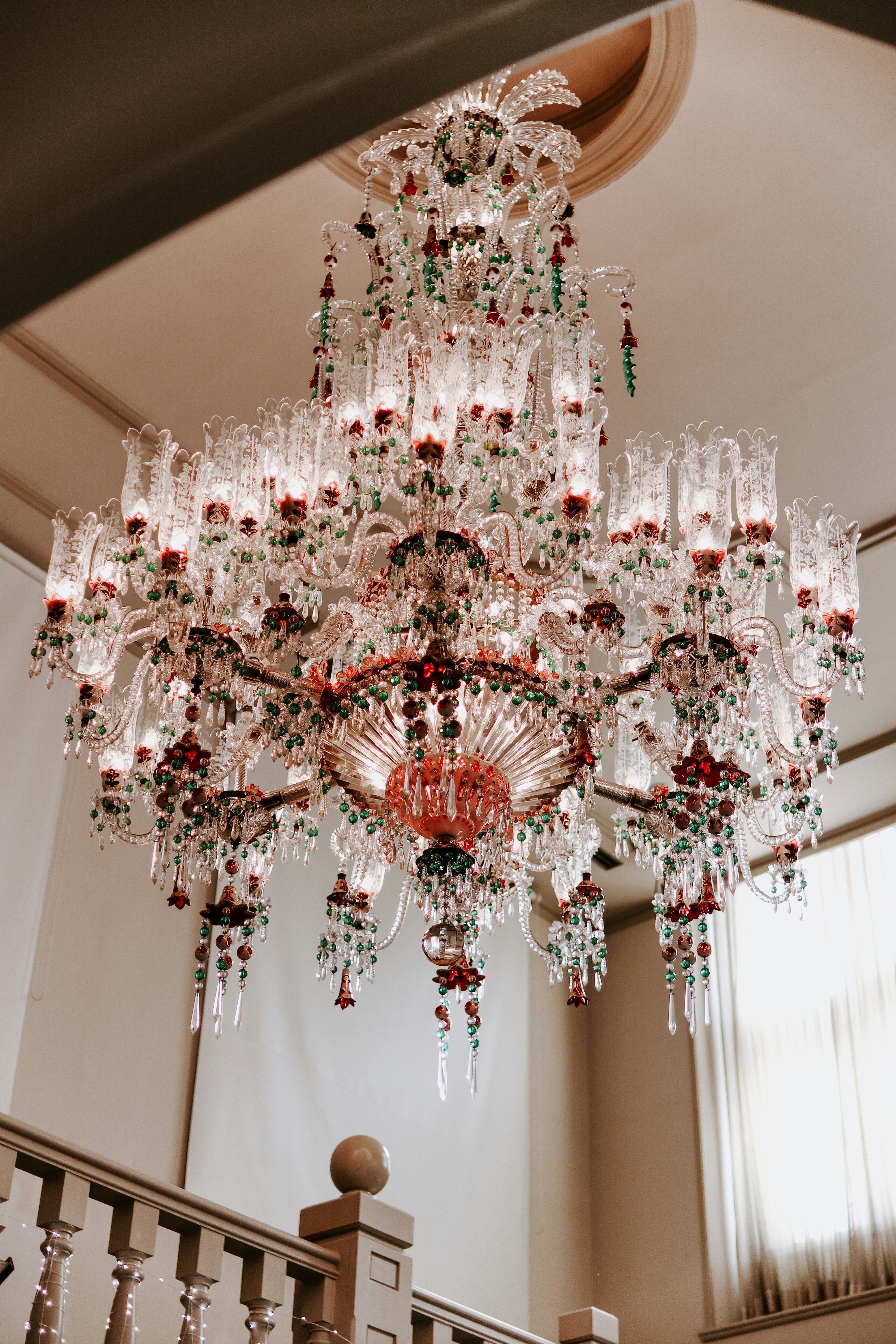 clear glass chandelier turned on inside room