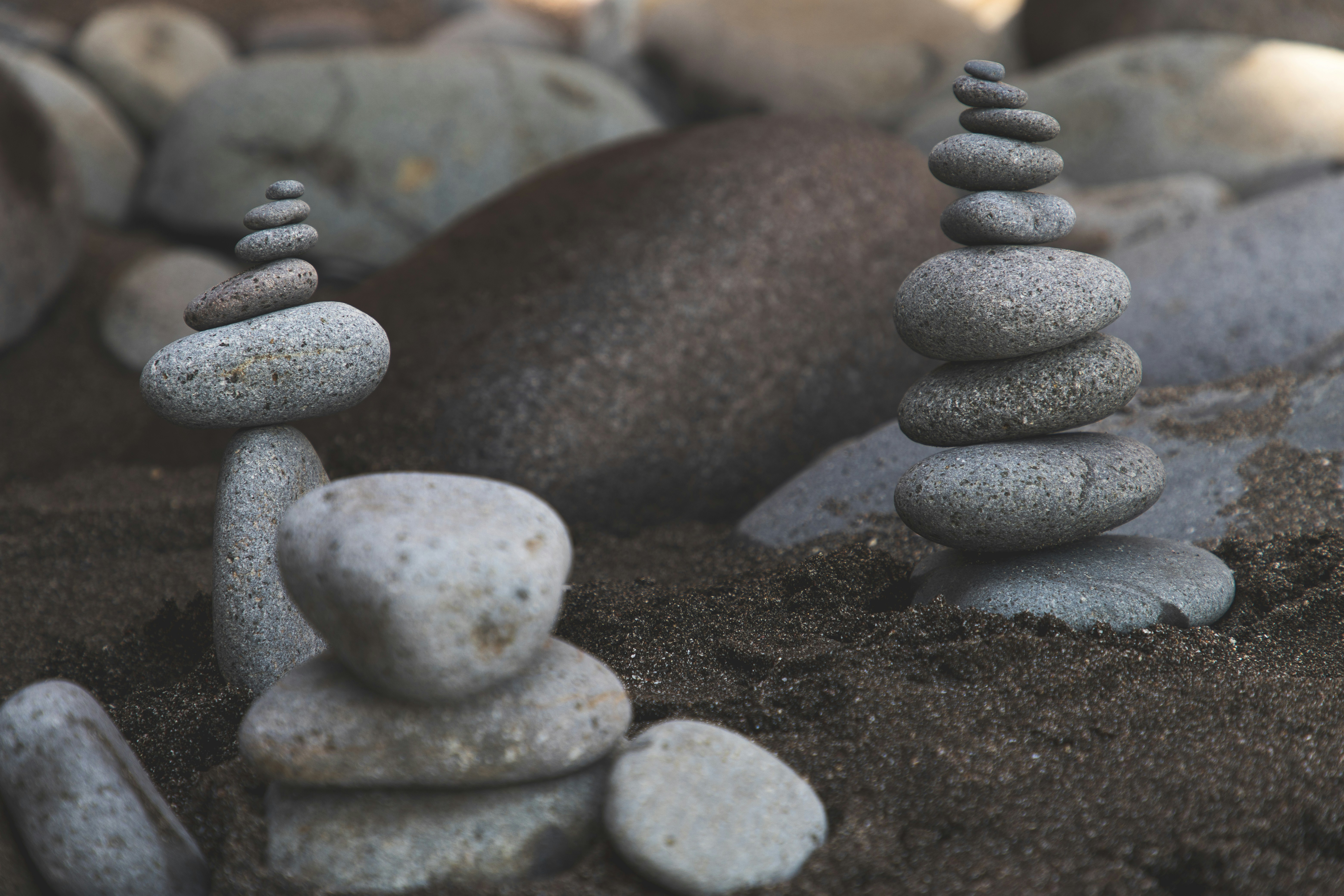 Zen Stacks: Pebble Towers on Quiet Sand