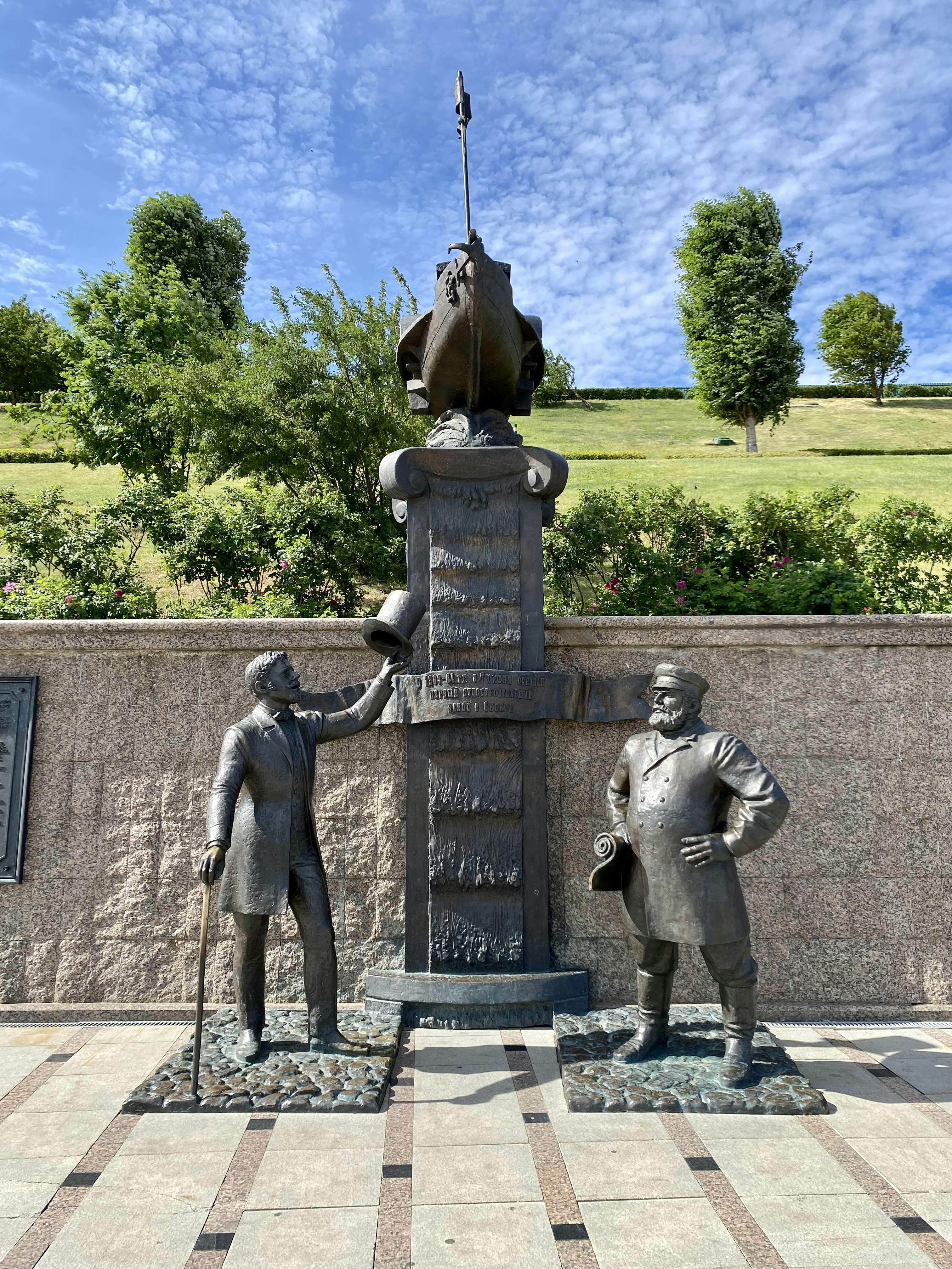 man in black suit statue