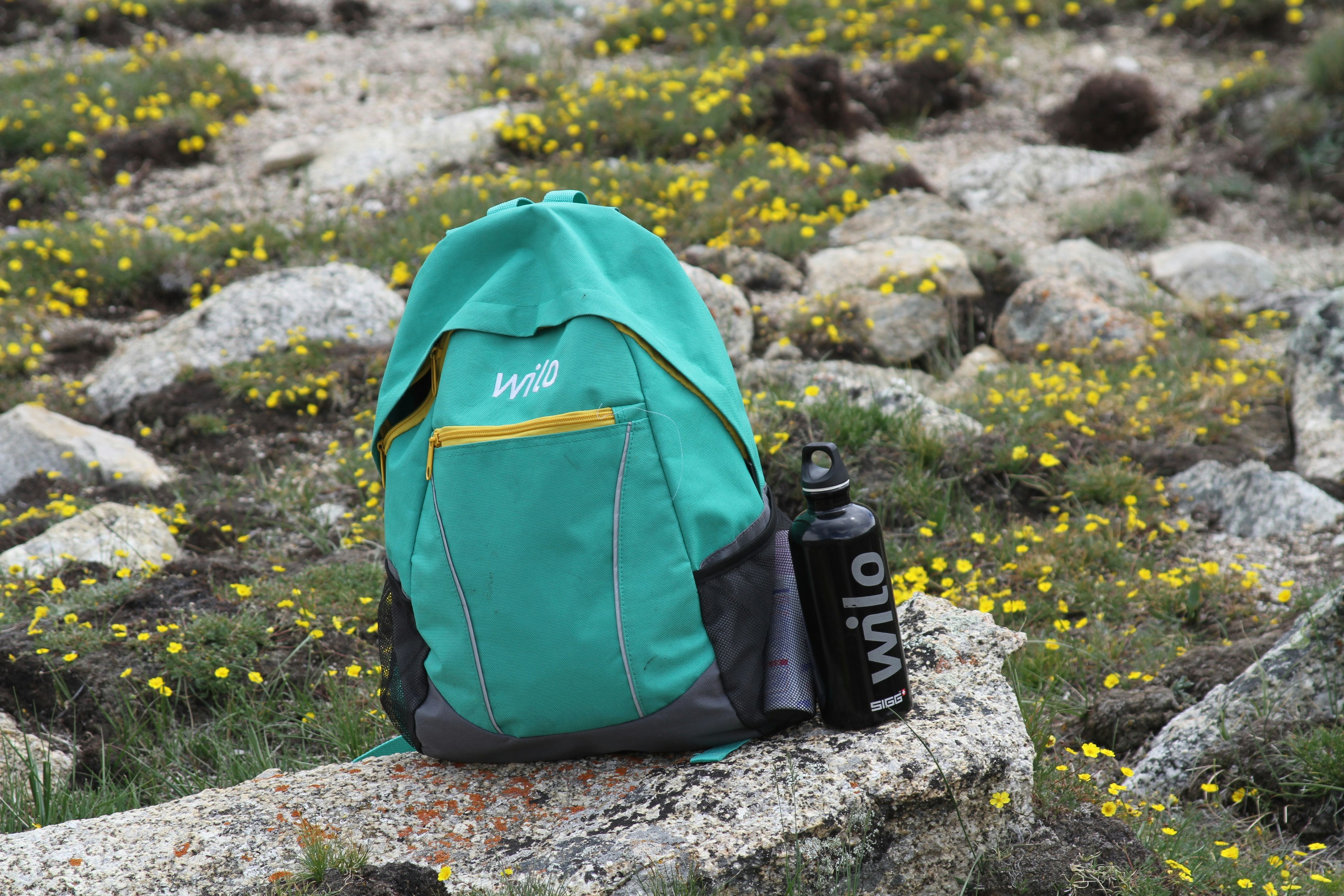 Green and black backpack on rocky ground photo – Free Mongolia Image on ...