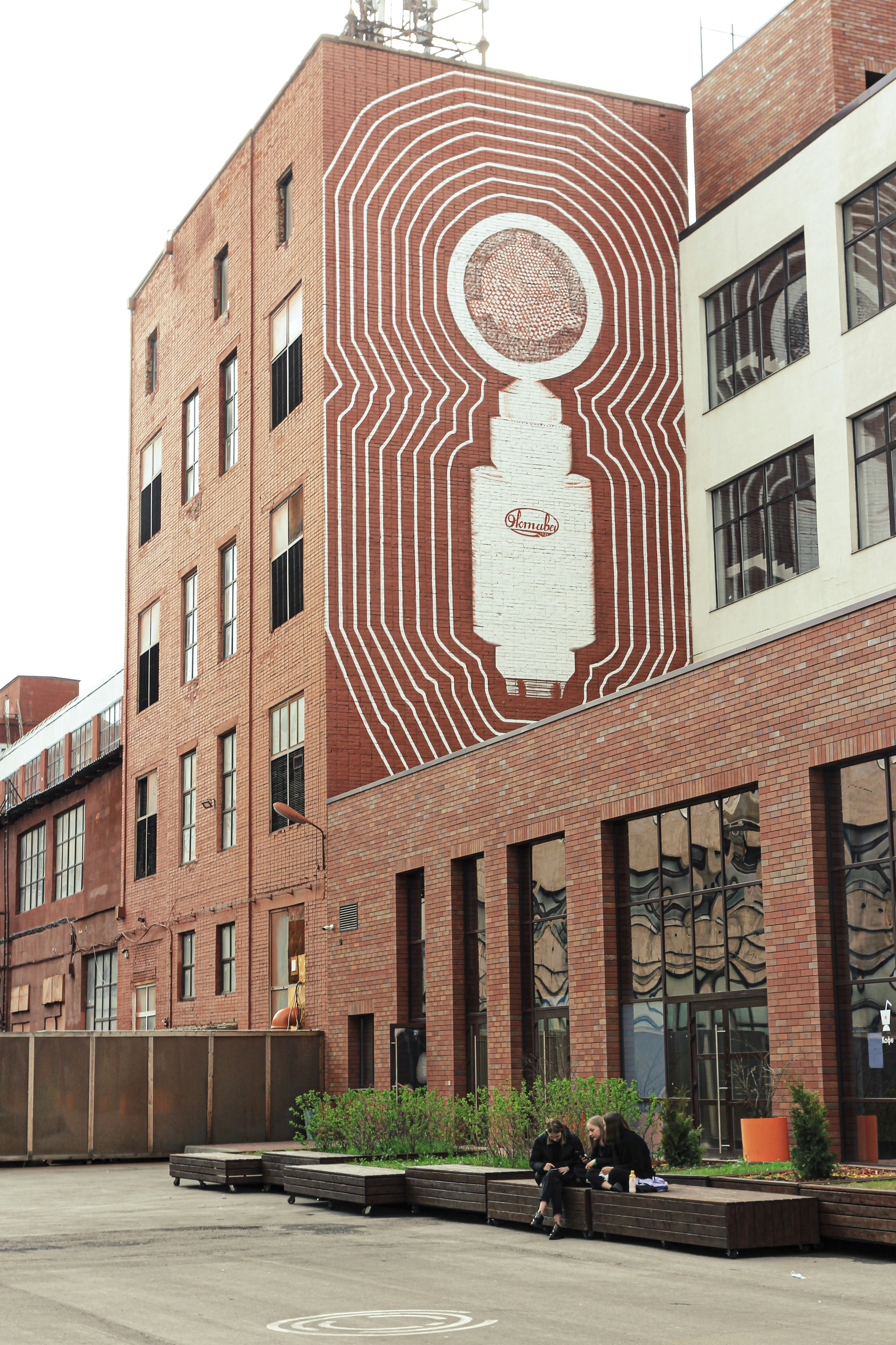Circling the City: Concentric Ring Mural on a Brick Facade