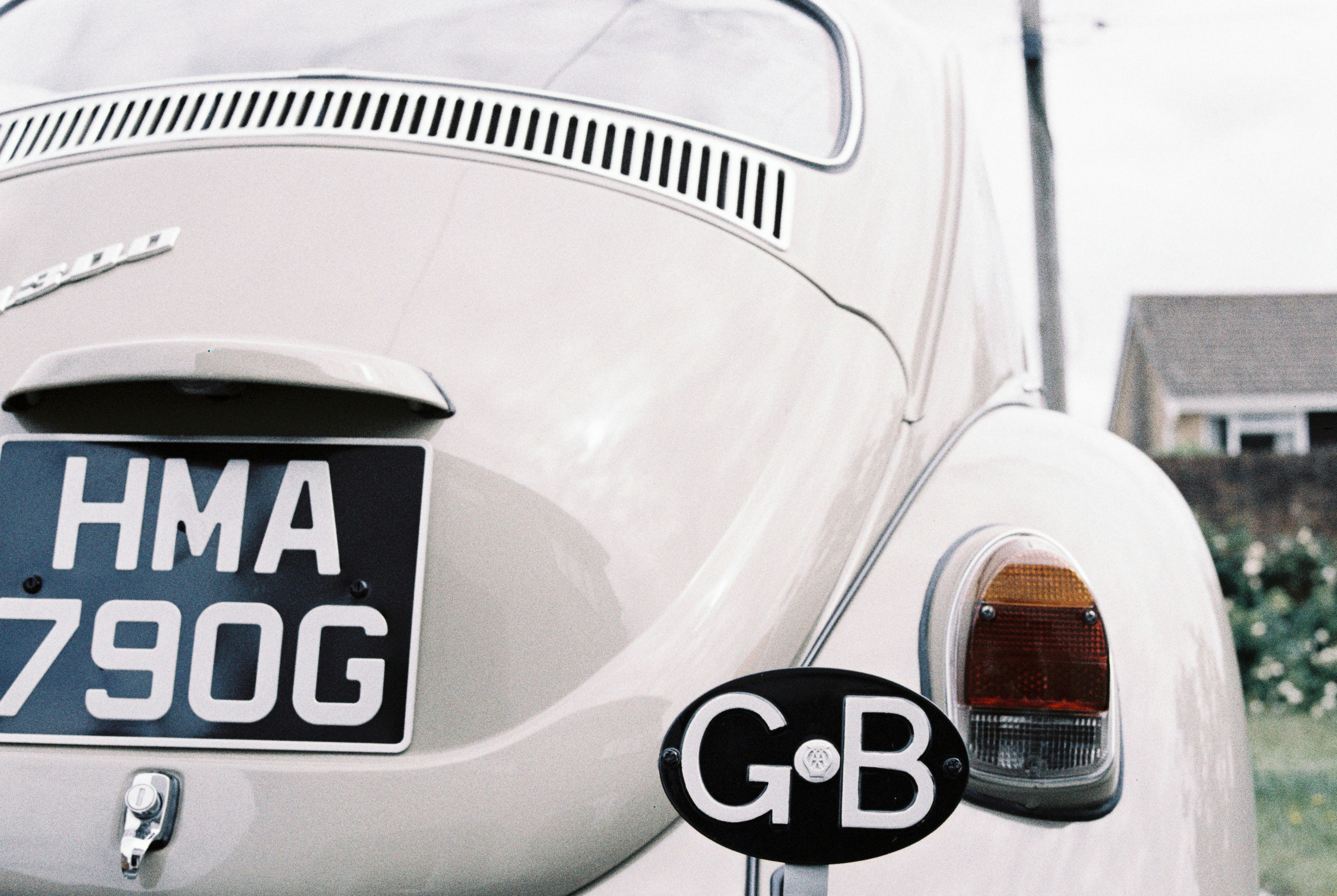 Rear-View Charm: Classic Beetle with a Black Gnomic Sticker