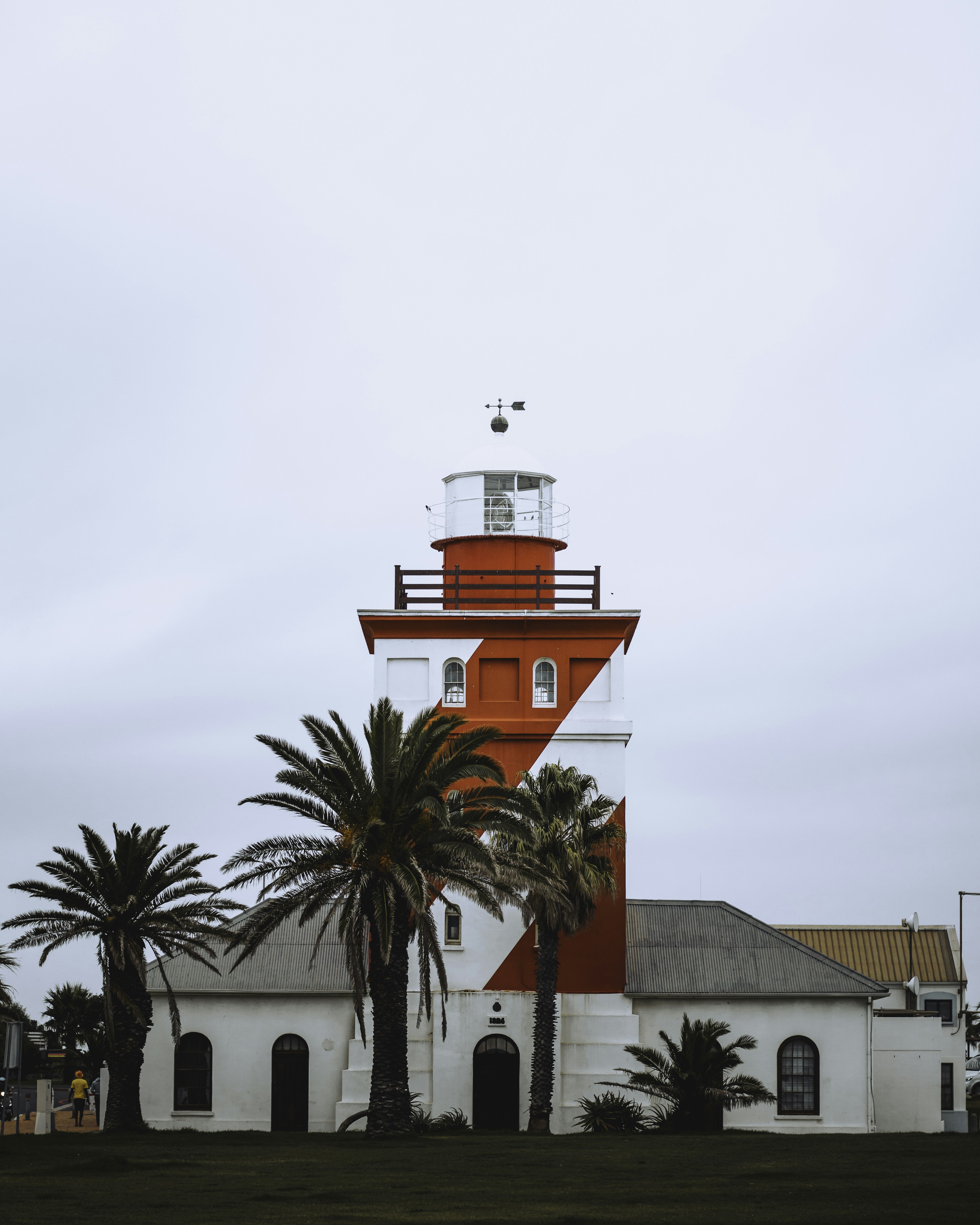 Palm-Fringed Lighthouse Standing Watch Over a Quiet Seaside