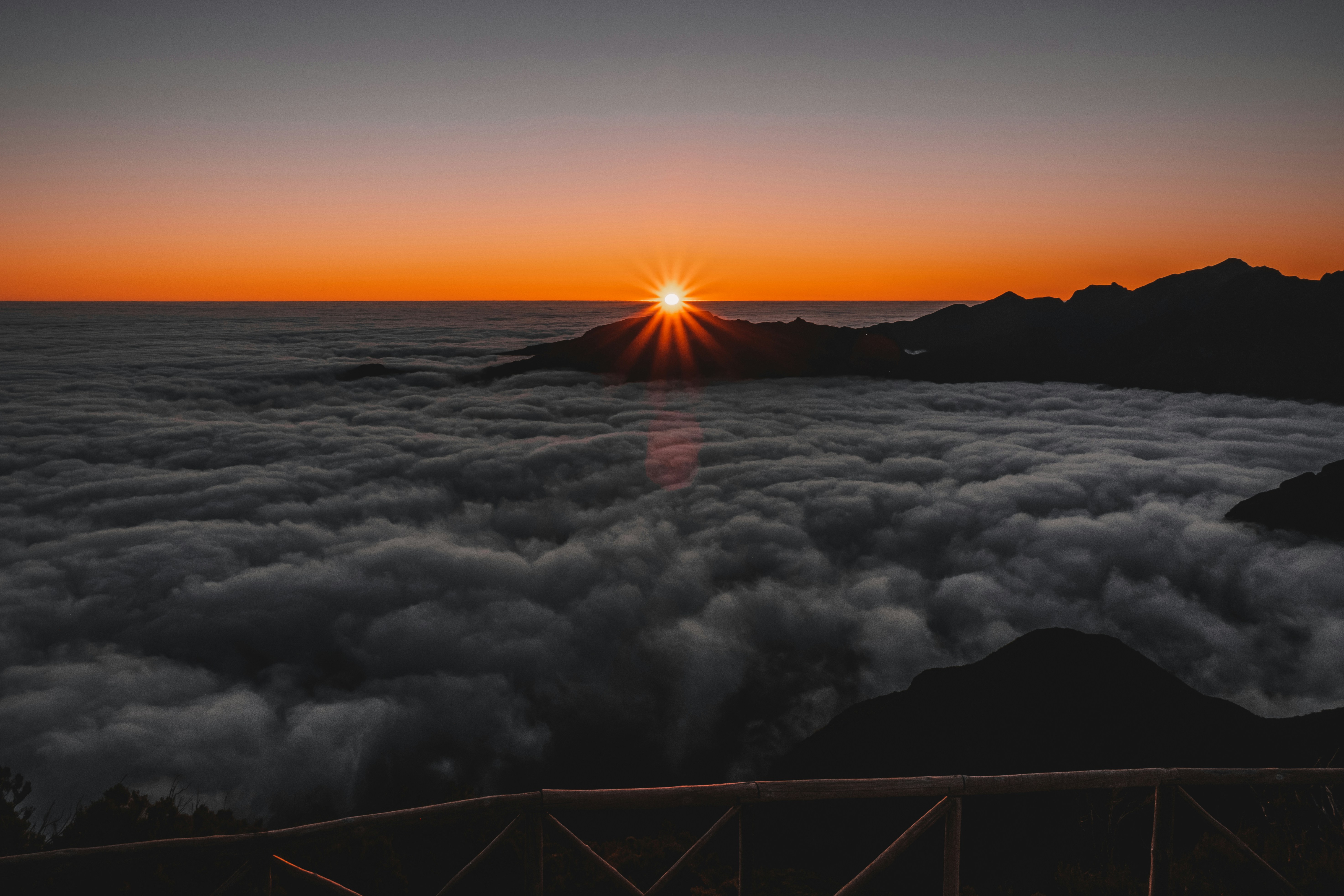Crimson Sunrise on the Sea of Clouds from a Mountain Ridge