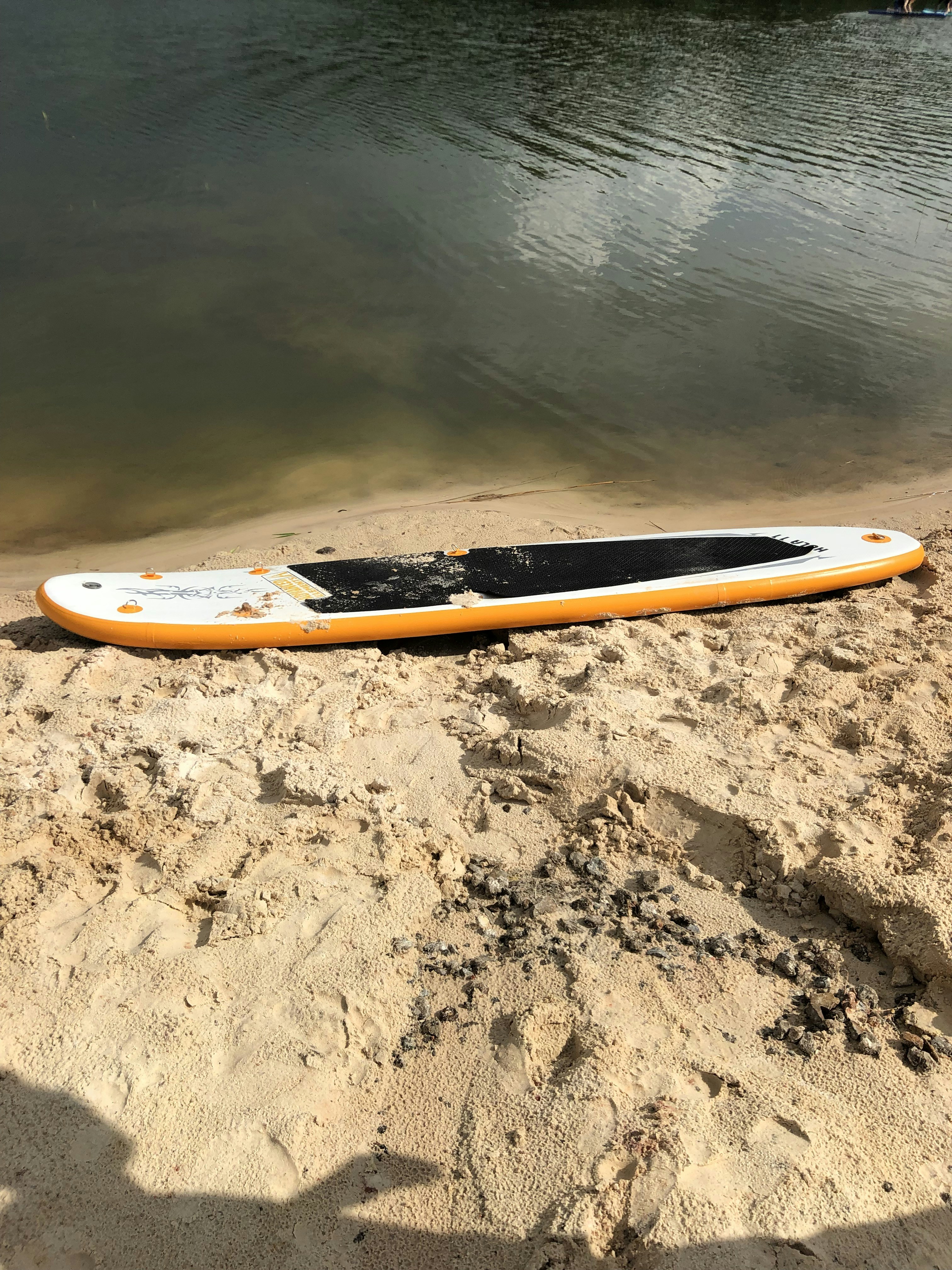 Yellow and white kayak on brown sand photo – Free Beach Image on Unsplash