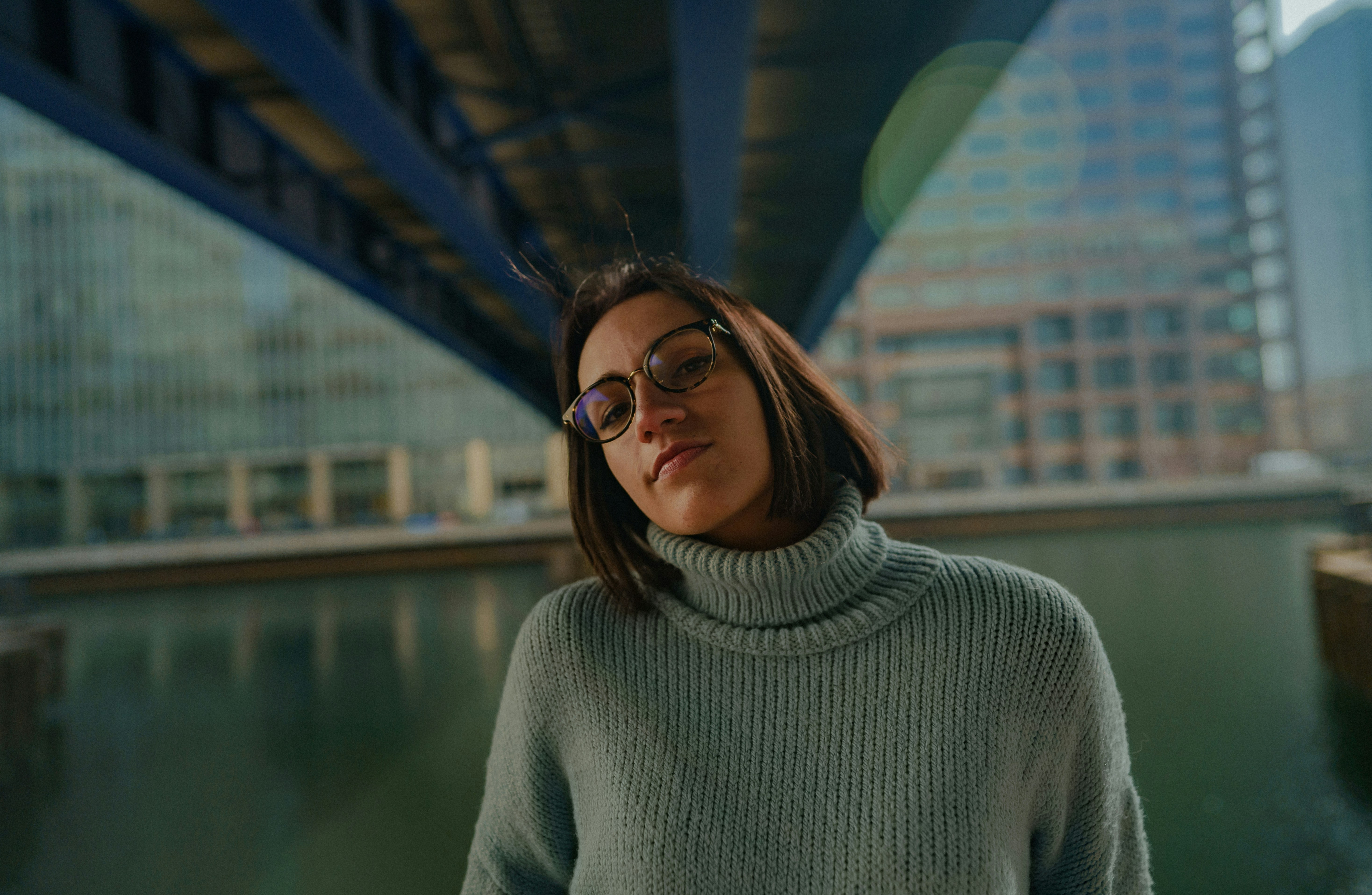 Brunette Girl wearing a green sweater in London