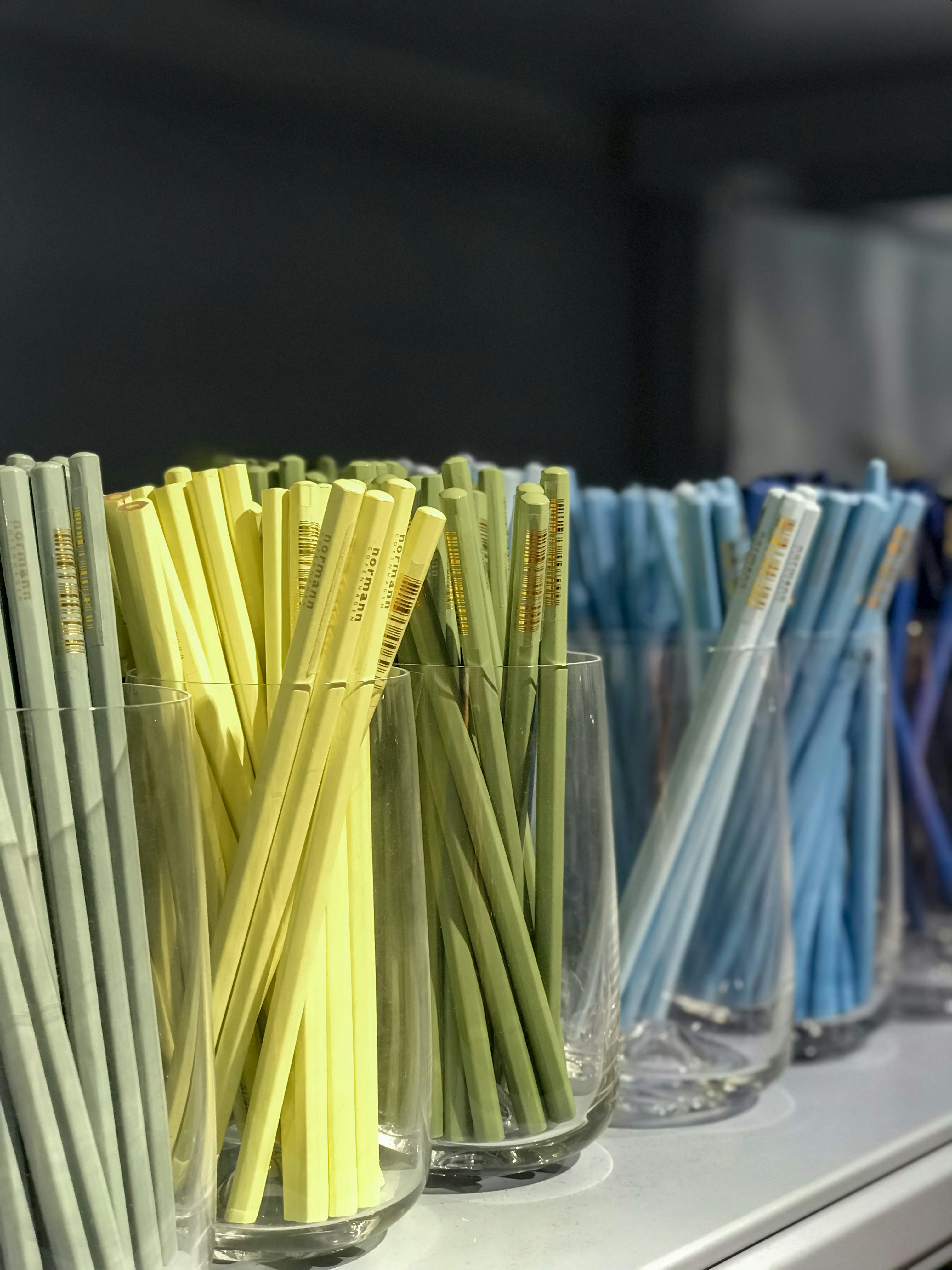 Pastel Gradient in Glass: A Row of Pencils from Yellow to Blue