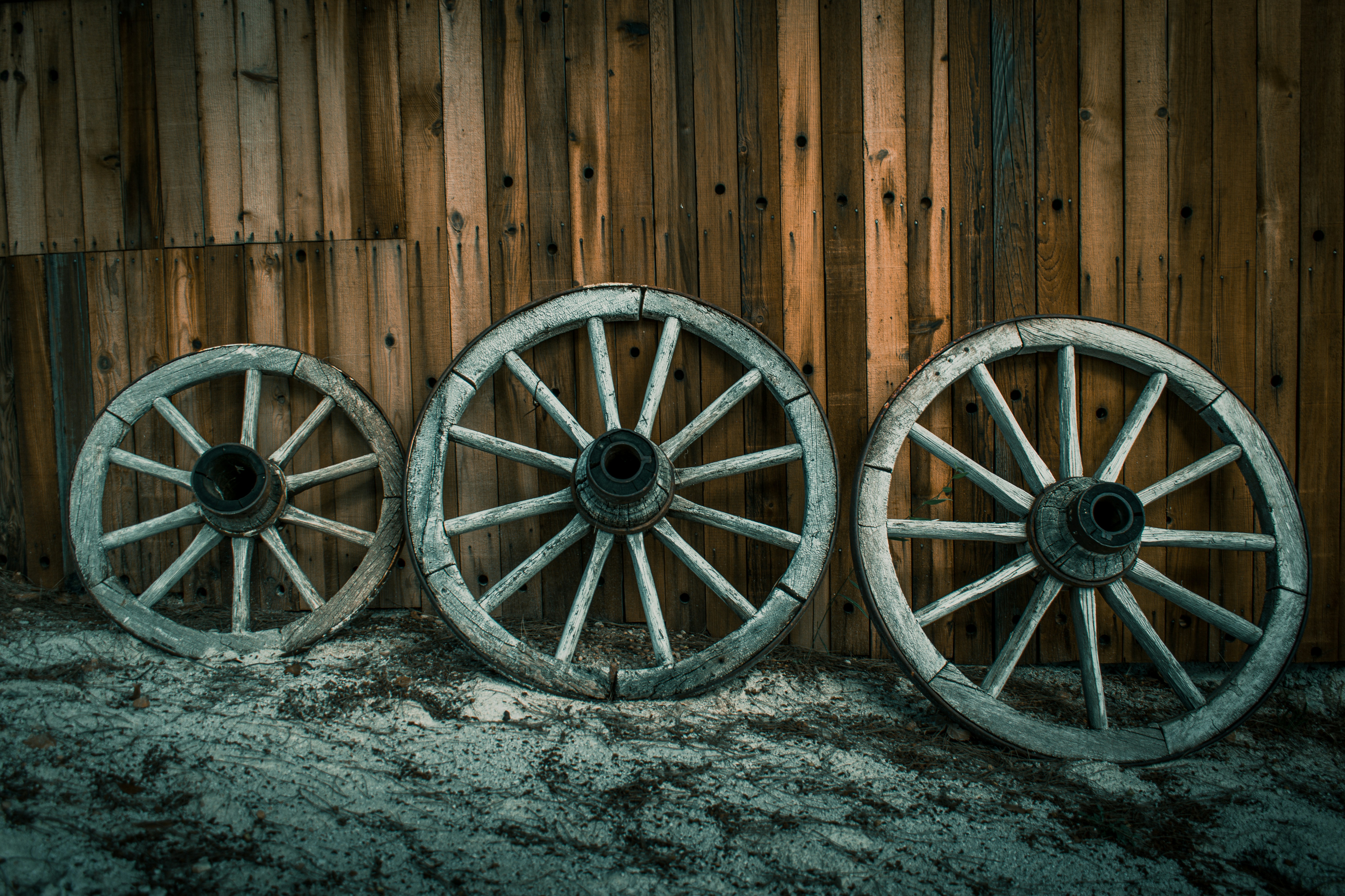 brown wooden wheel on brown wooden wall