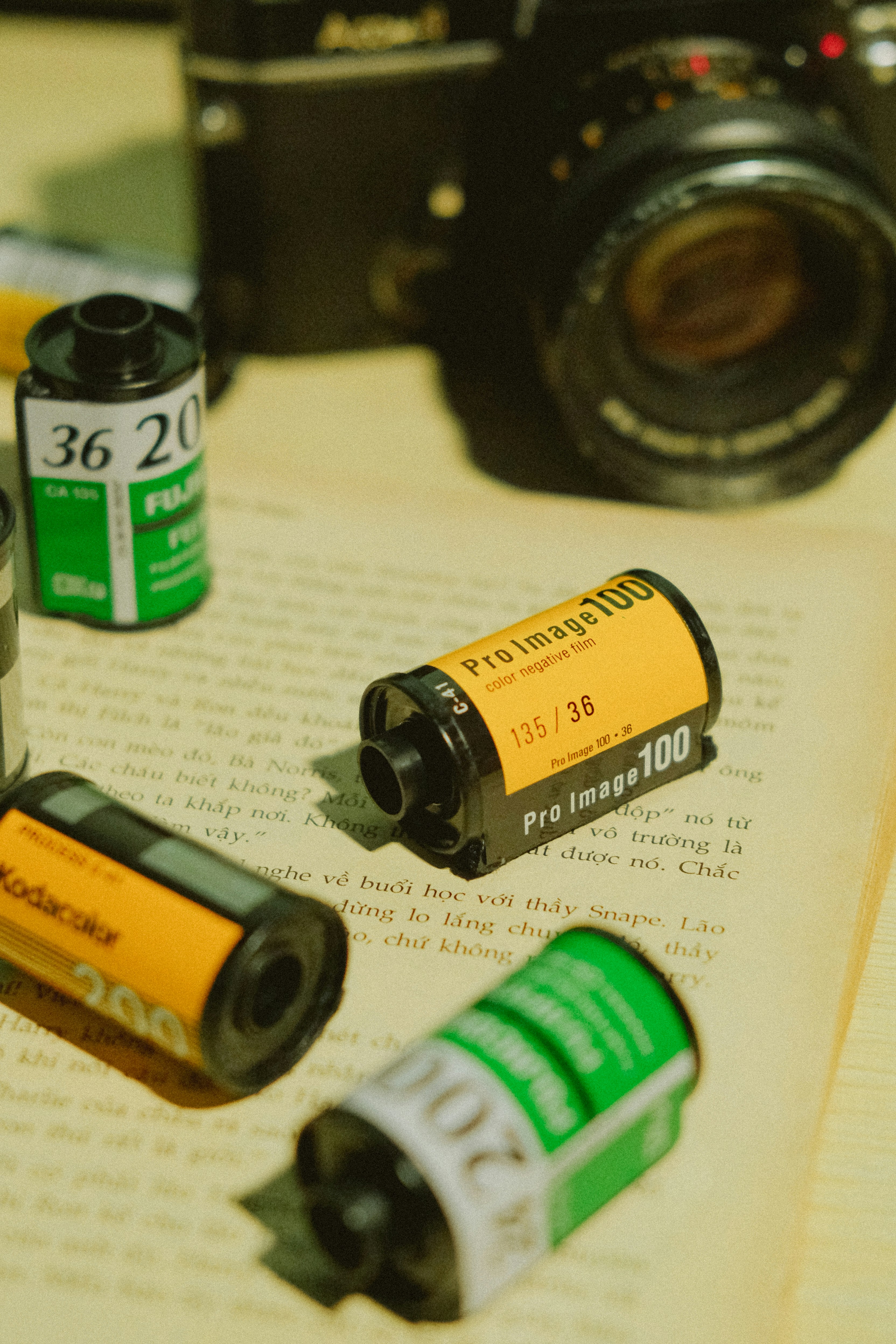 Pro Image 100: A Studio of Old Film Canisters and a Silent SLR