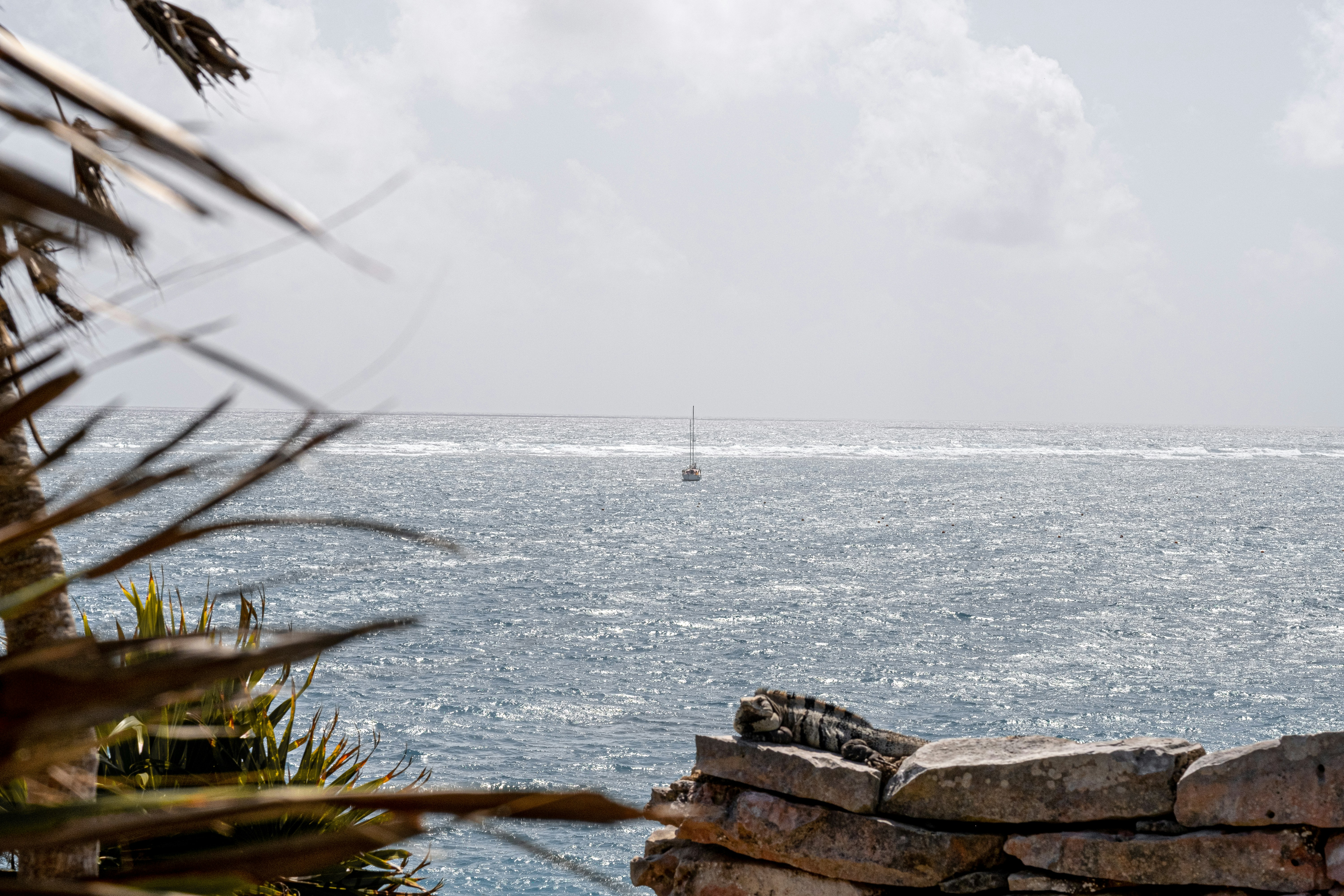 Sail on the Quiet Horizon: A Stone-Framed Sea View