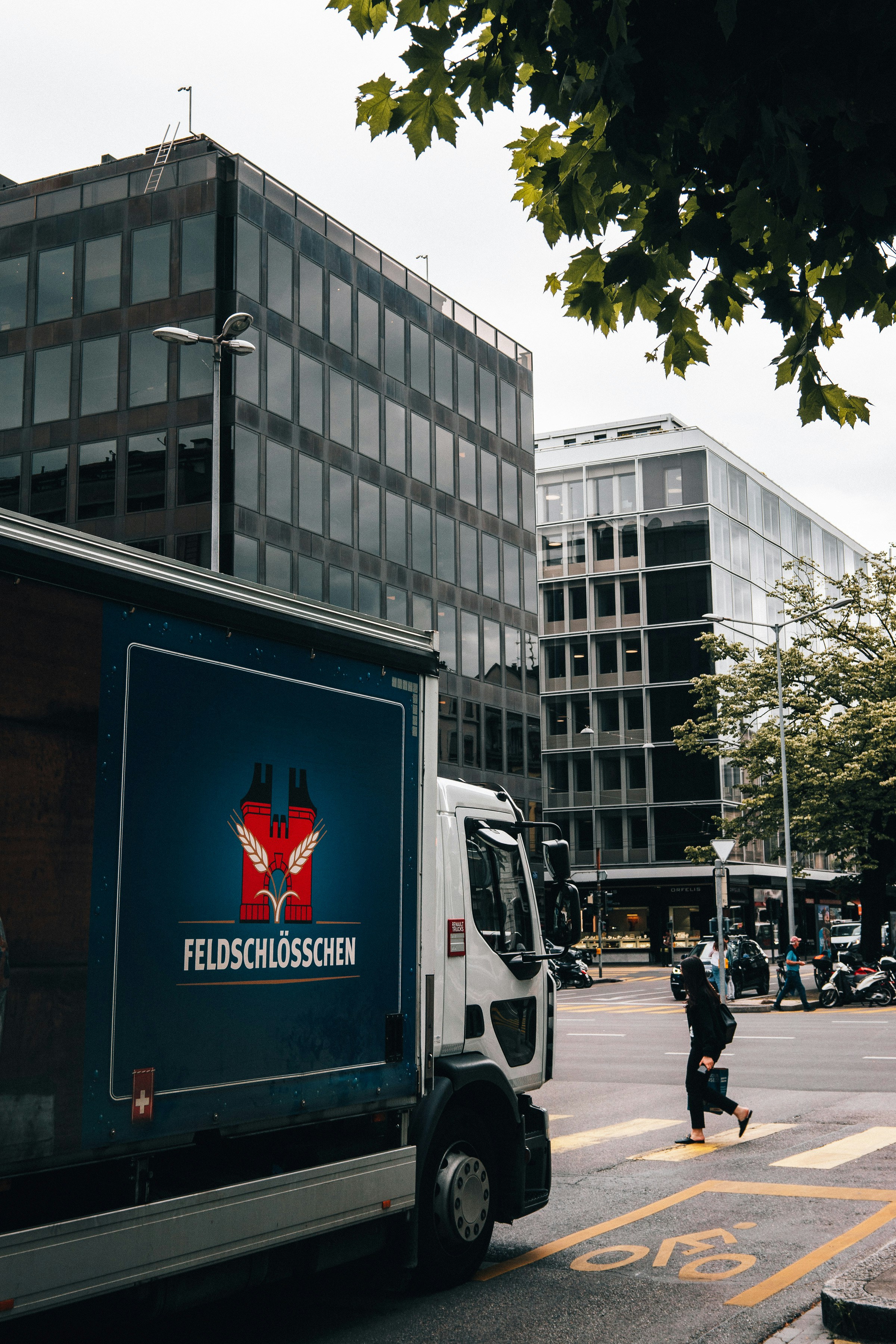 Urban Delivery: Truck, Crosswalk, and Concrete Canopy