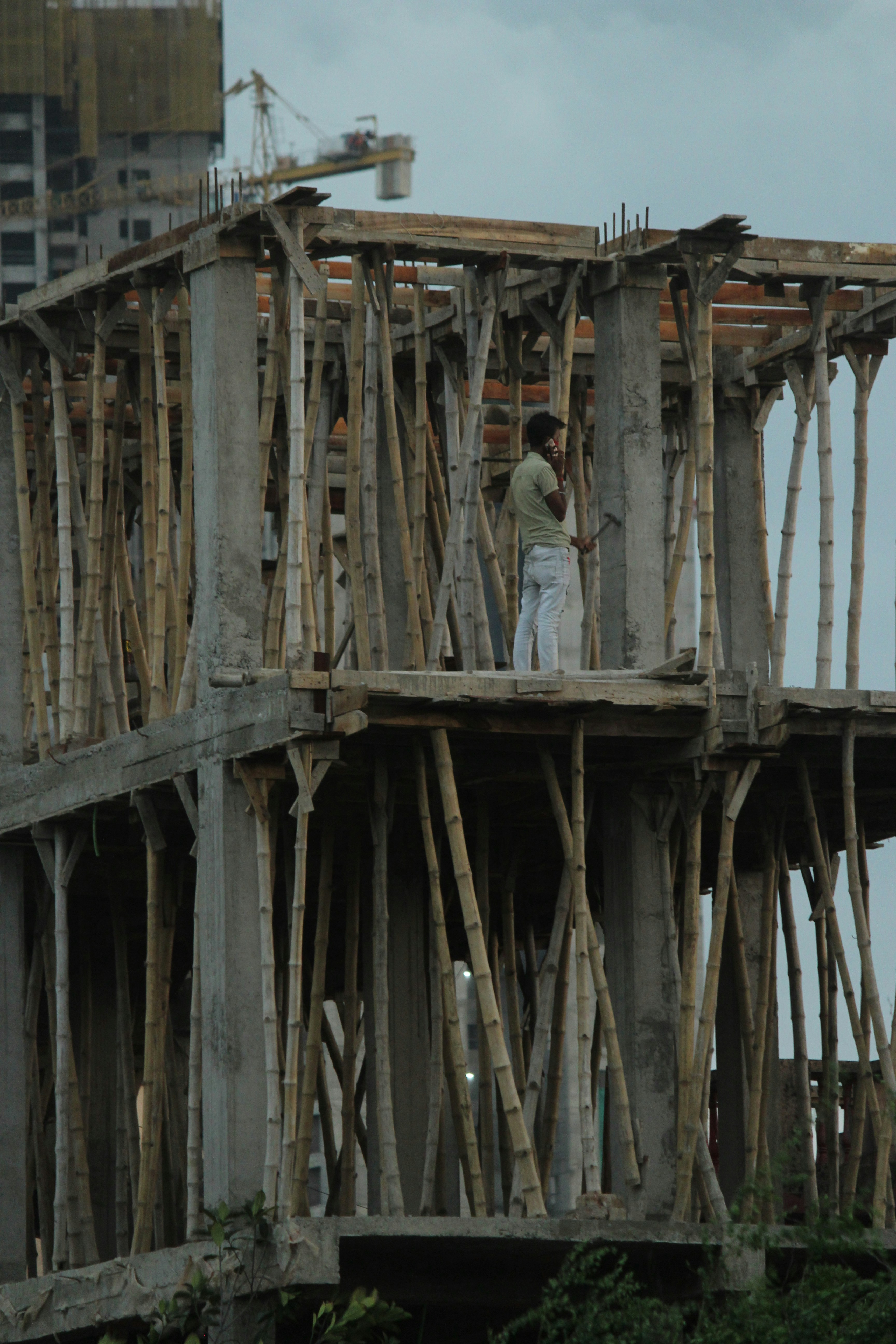 Man in blue denim jacket and blue denim jeans standing on wooden dock ...