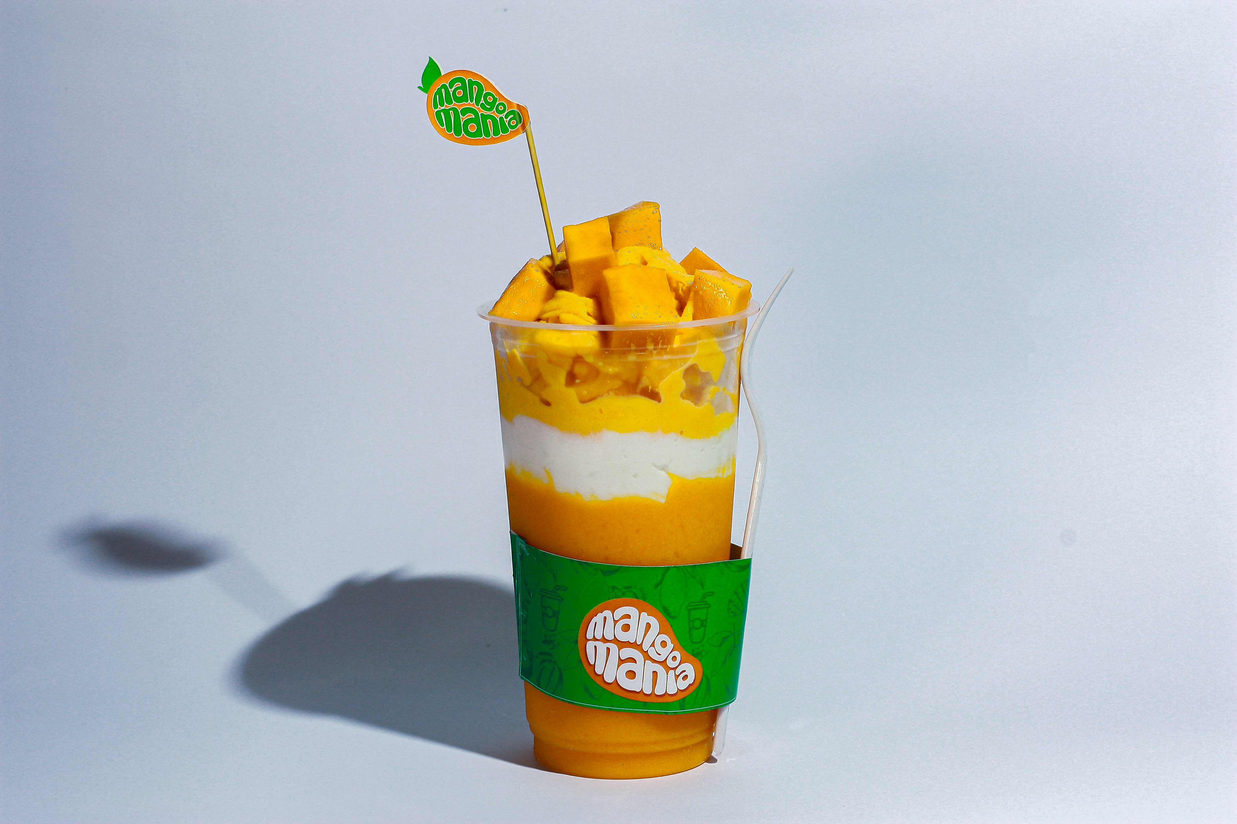 Golden Mango Parfait in a Green Cup