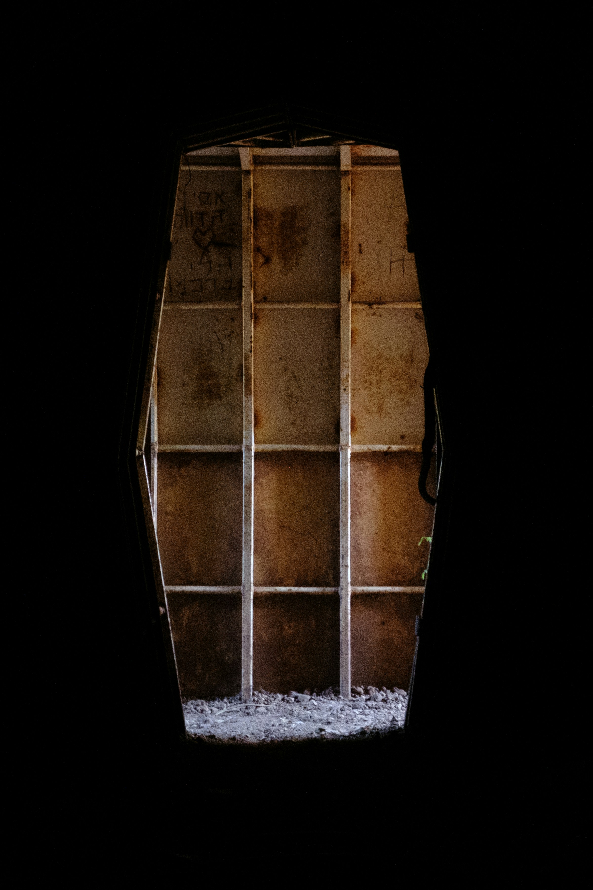 Rust Gate: A Quiet Light Piercing an Abandoned Portal