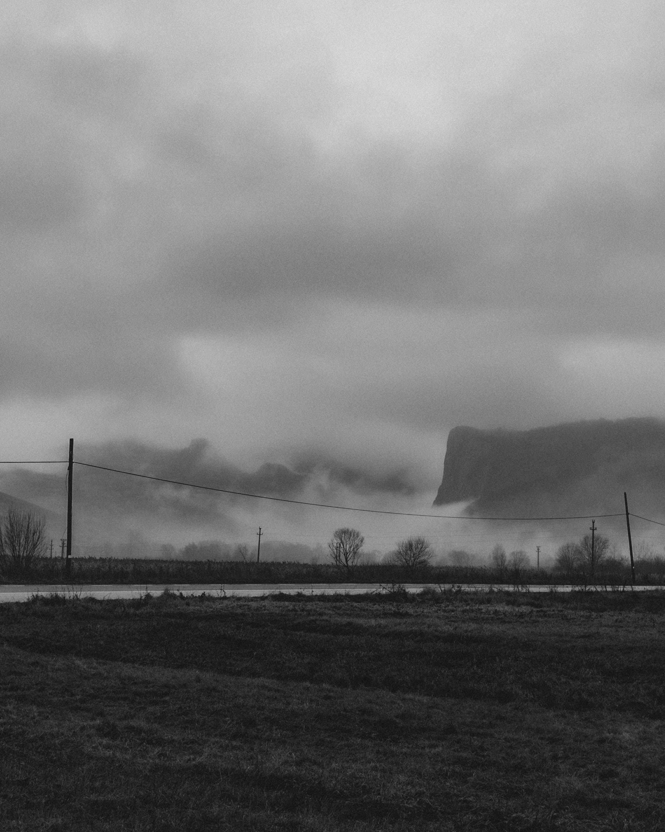 Fog-Softened Mesa Ridge Across a Quiet Plains