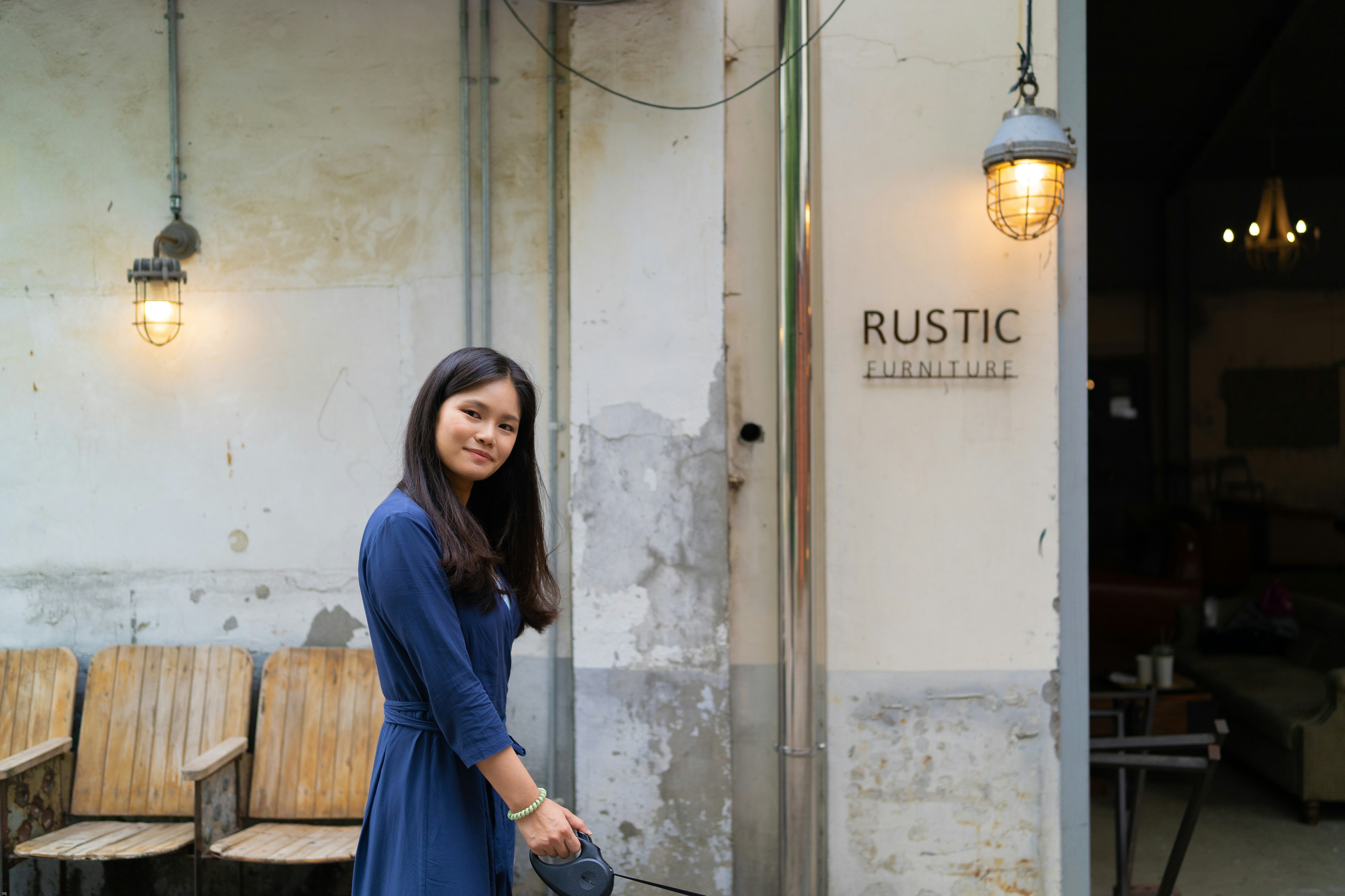 Blue Dress at the Rustic Shopfront: Quiet Portrait in Warm Light