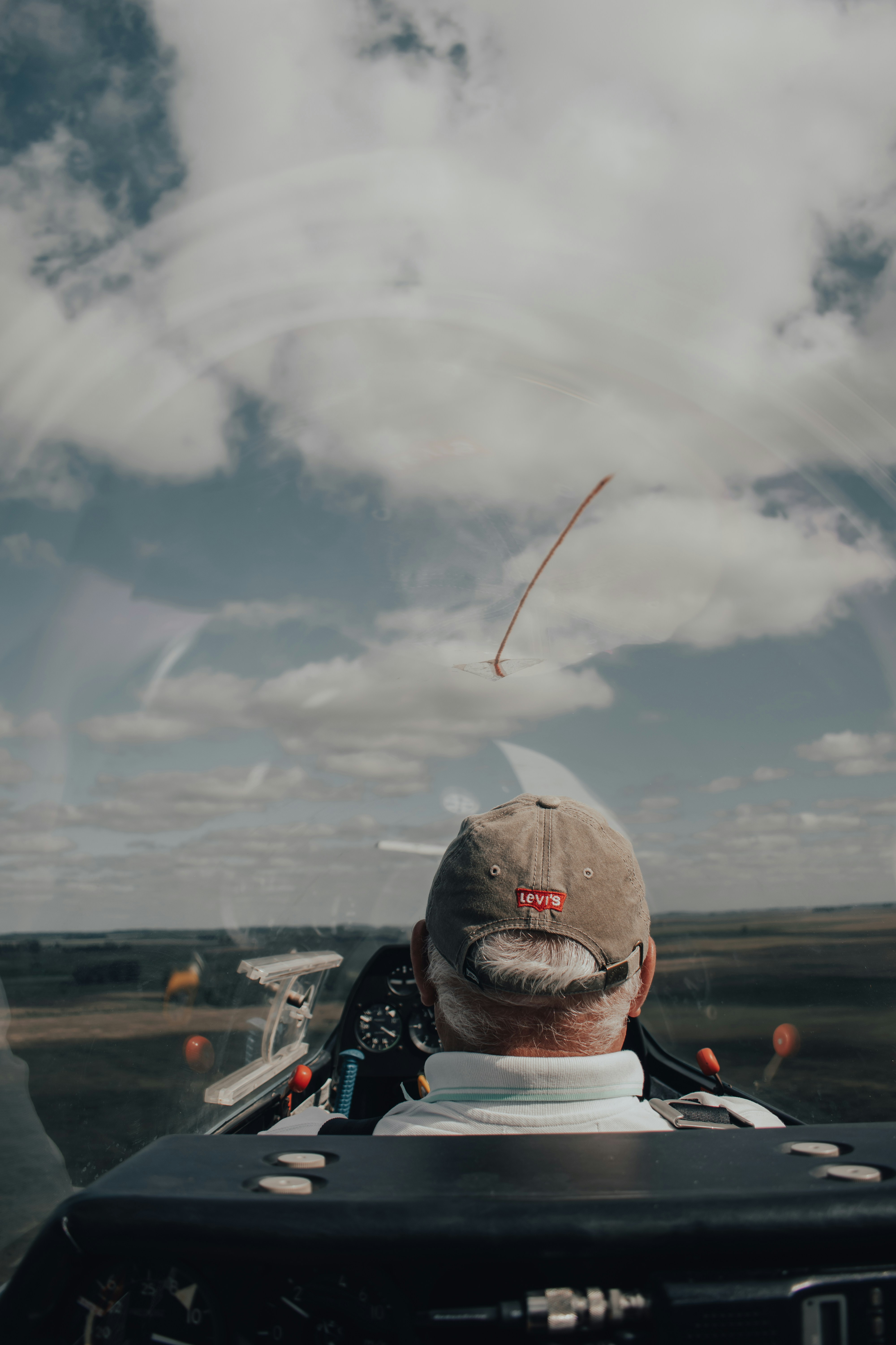 Levi's Cap Above the Fields: A Glider Pilot's Quiet Flight