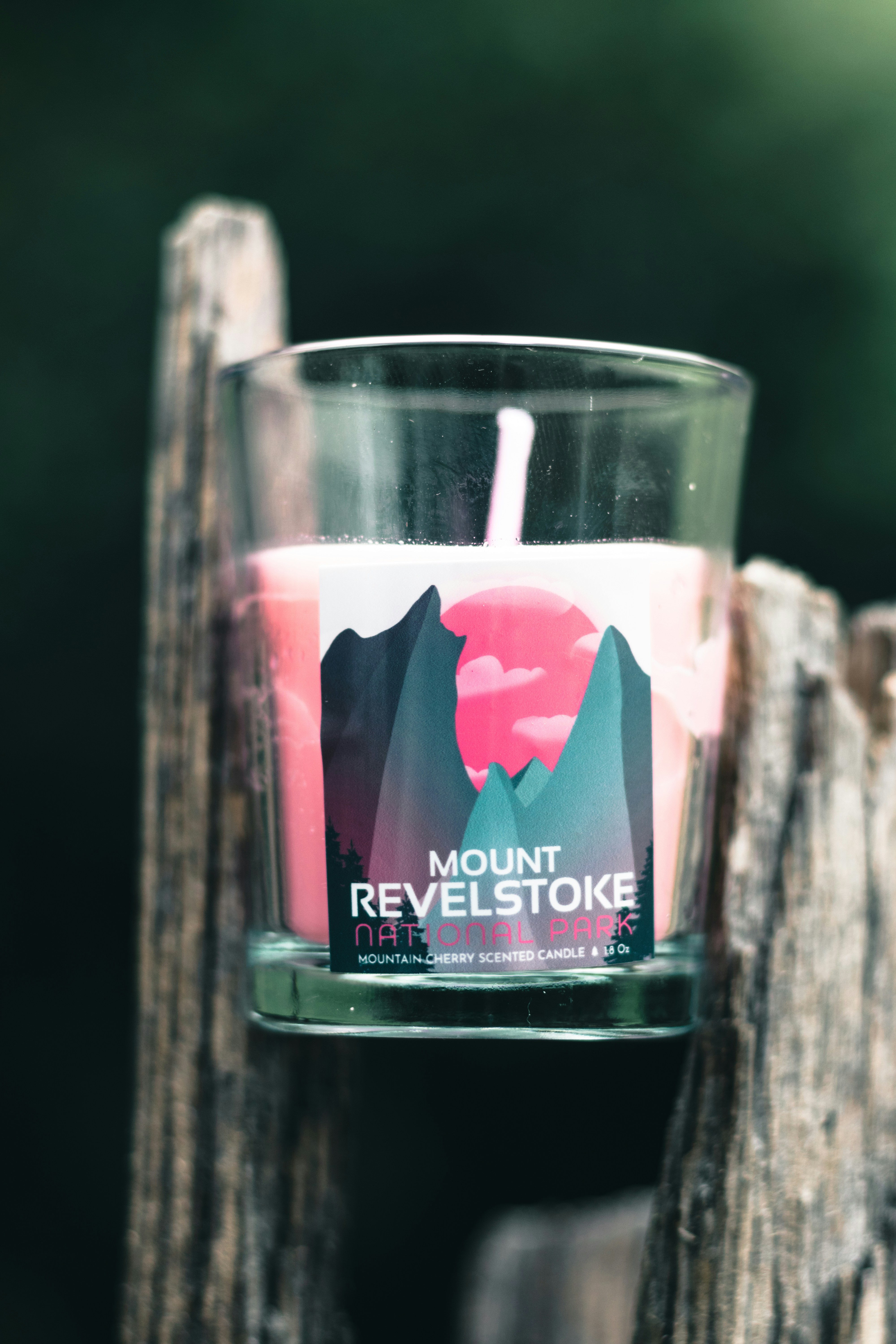 Pink Sunset in a Glass: Mount Revelstoke Candle on a Weathered Fence