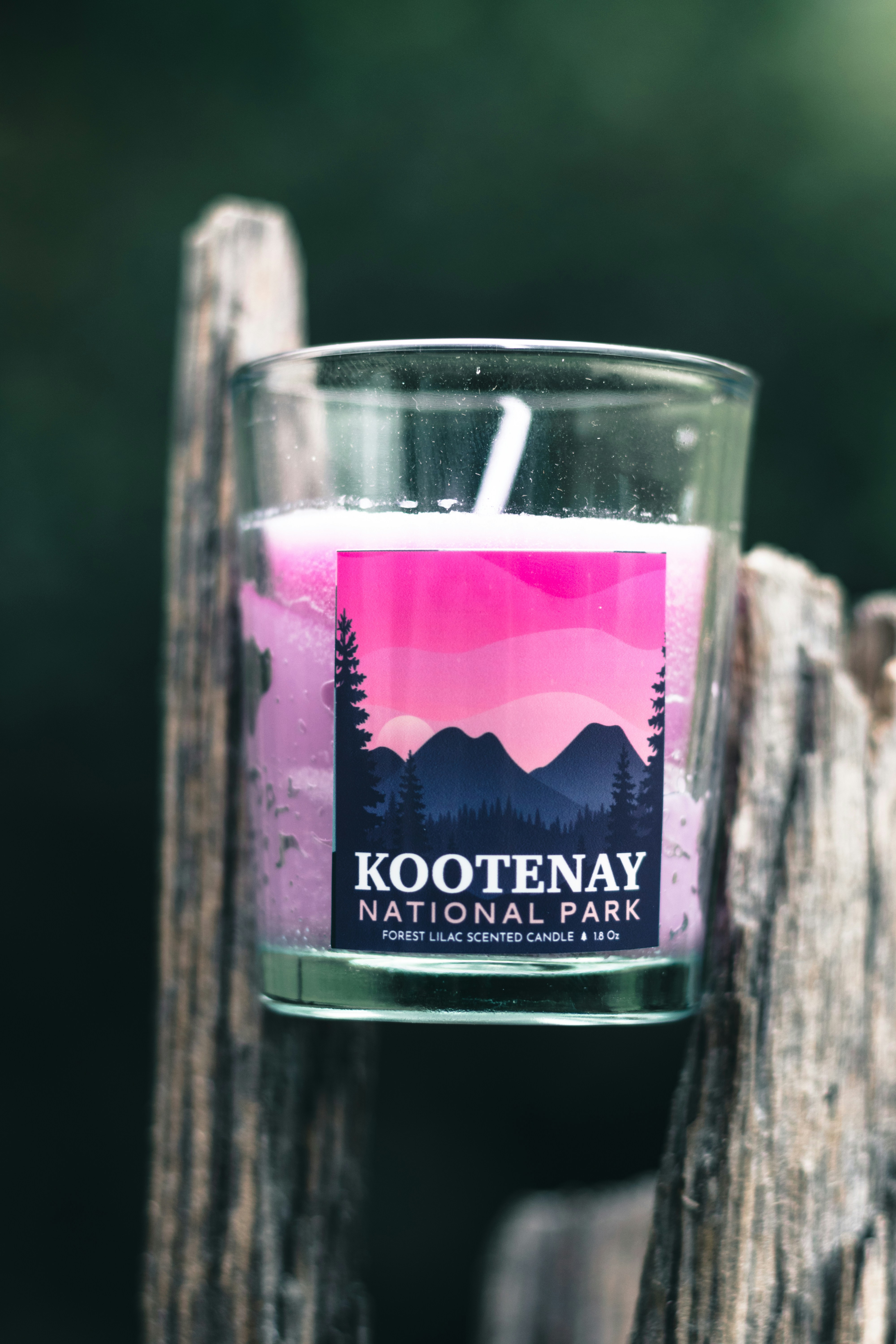 Pastel Peaks on a Weathered Post: A Kootenay National Park Candle in Focus