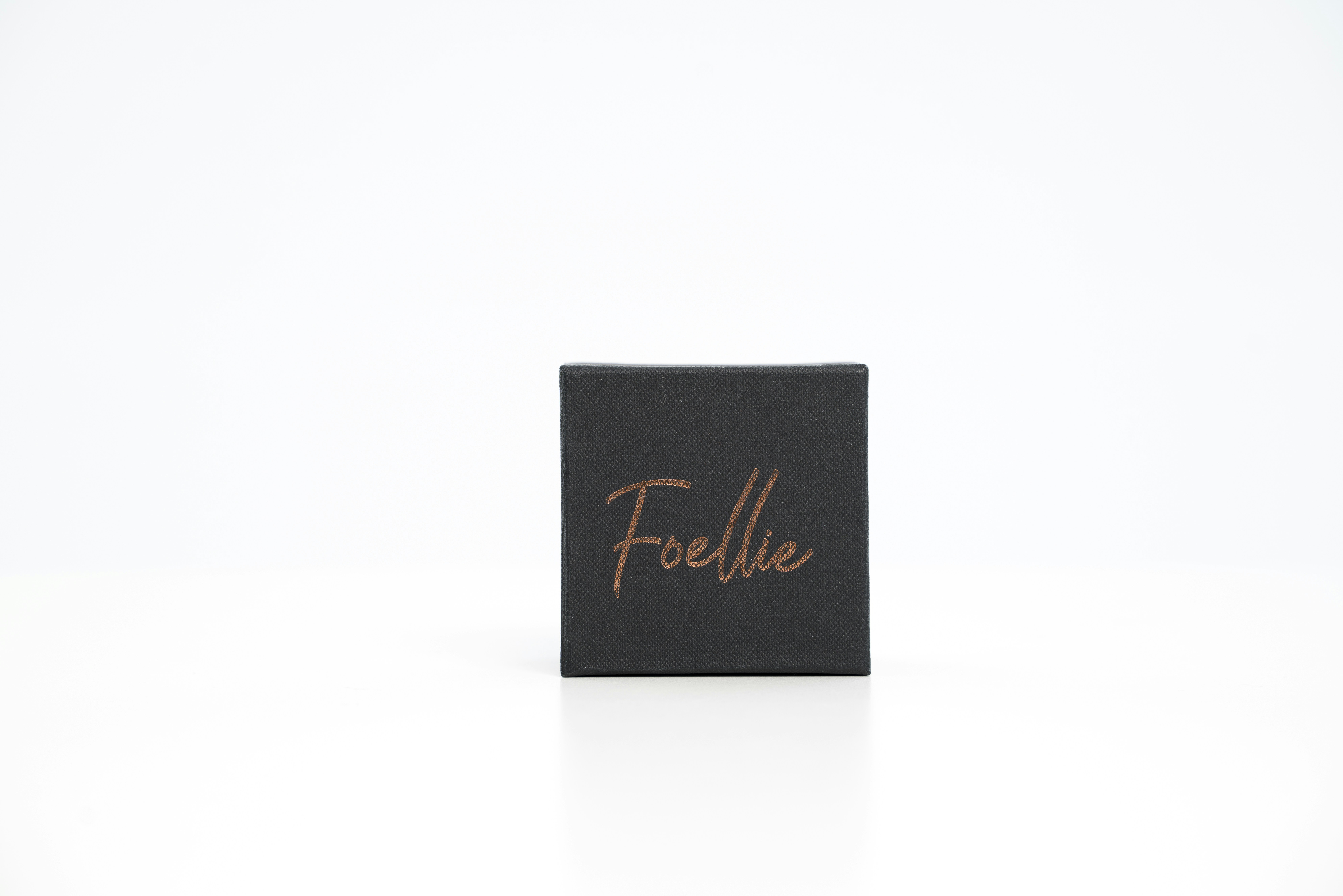 Foellie in Focus: A Minimalist Card on White Silence