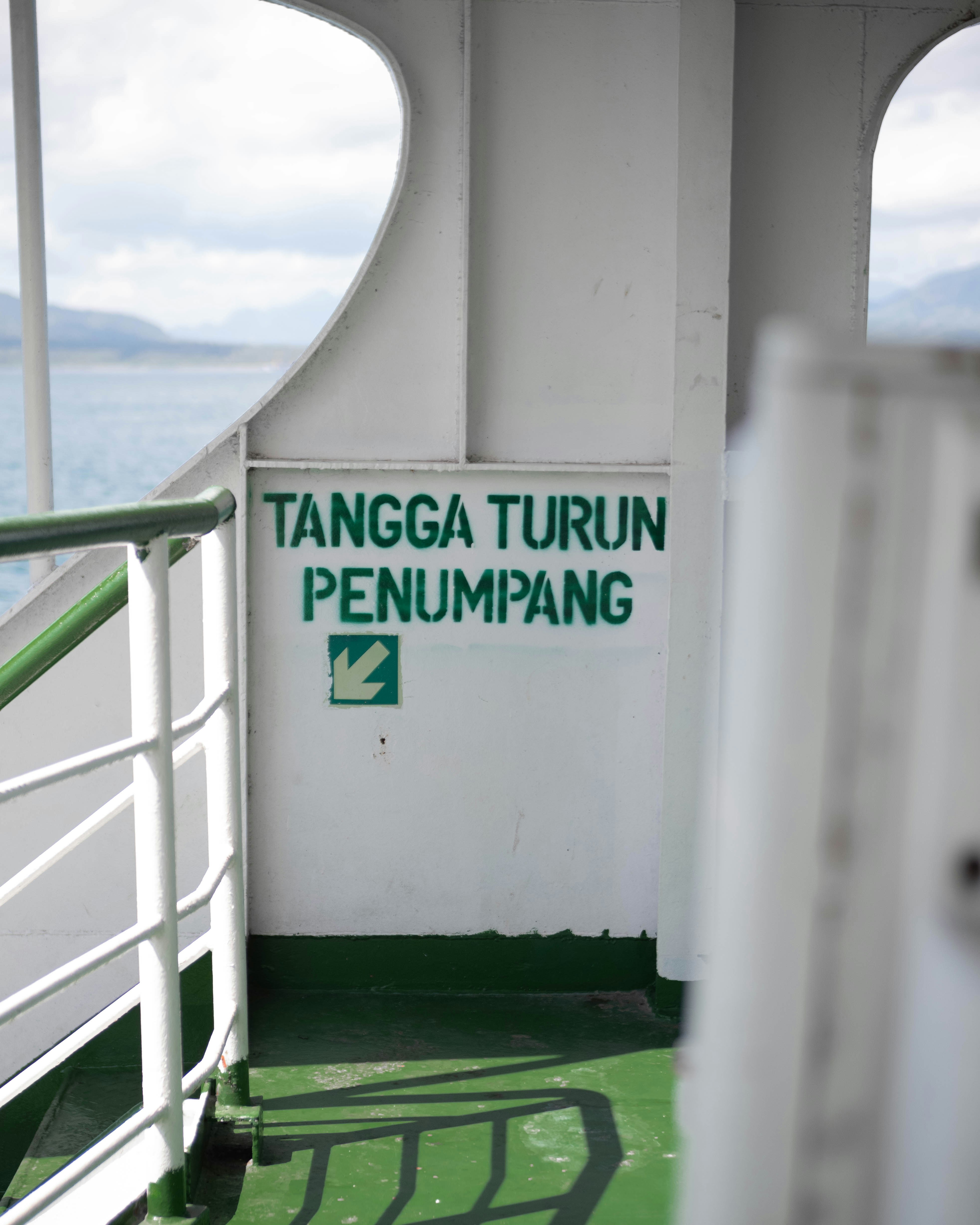 Green Signpost on a Ferry Corridor