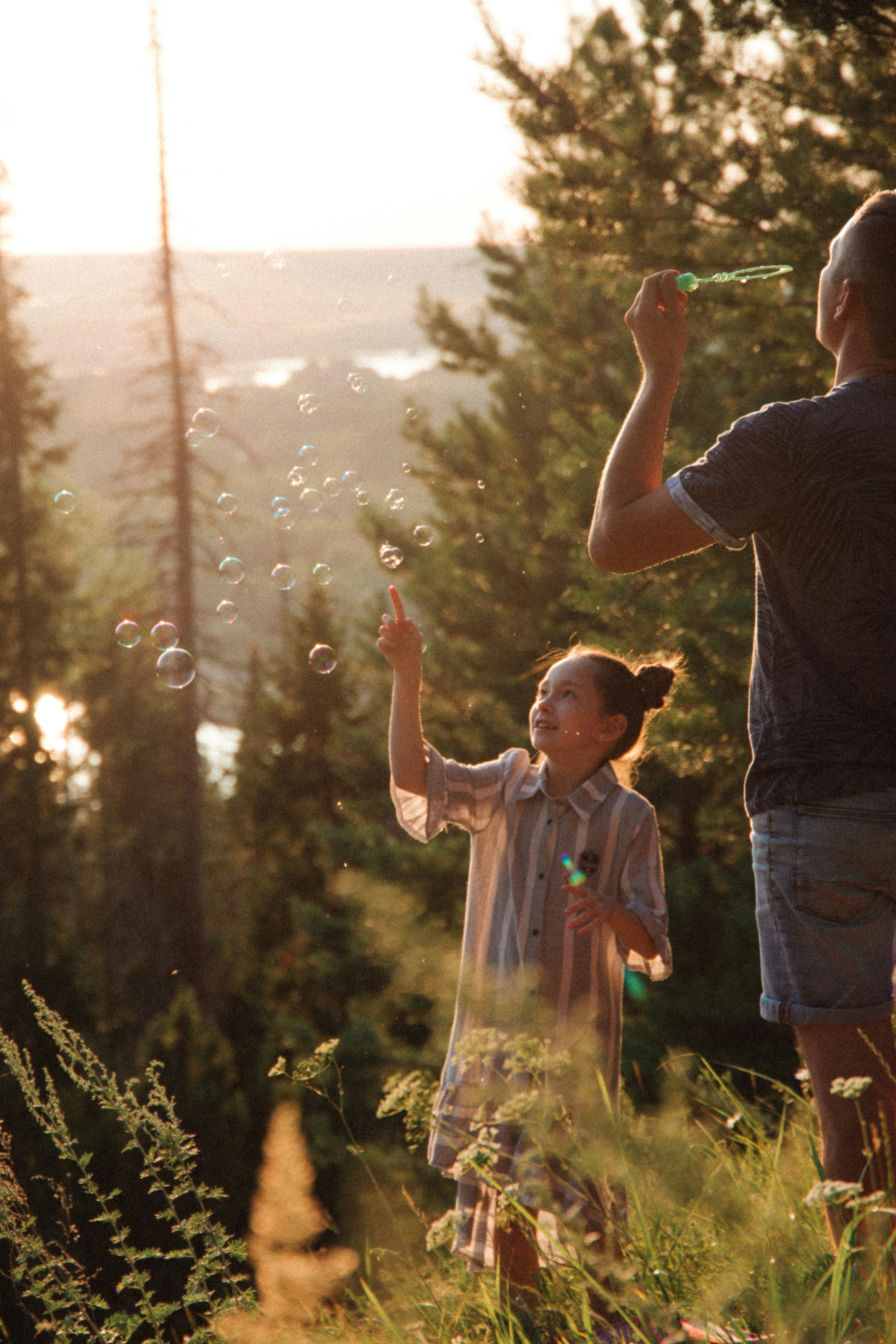 Whimsical Bubbles at Sunset: A Father and Daughter Crafting Moments
