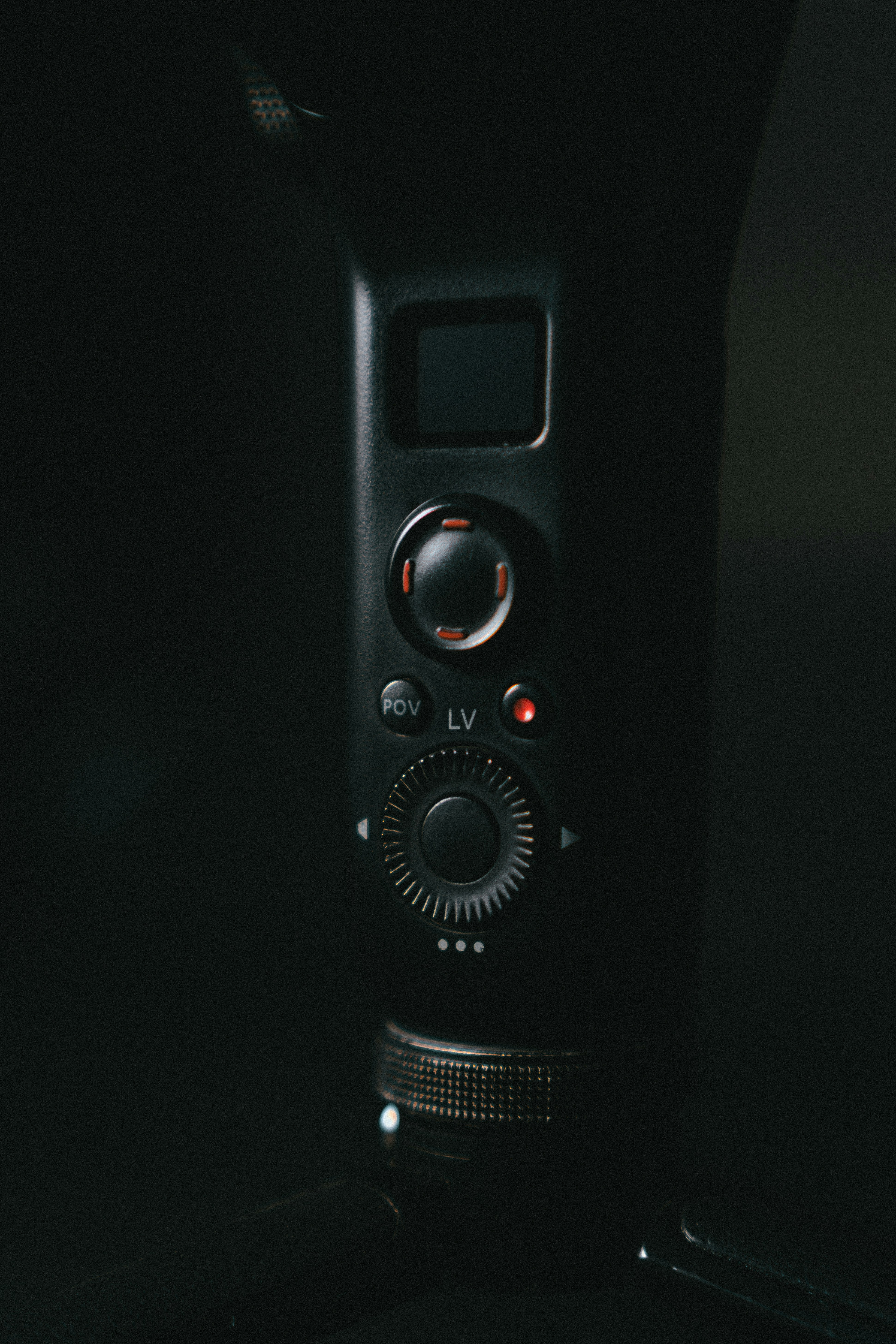 black and gray speaker on black surface