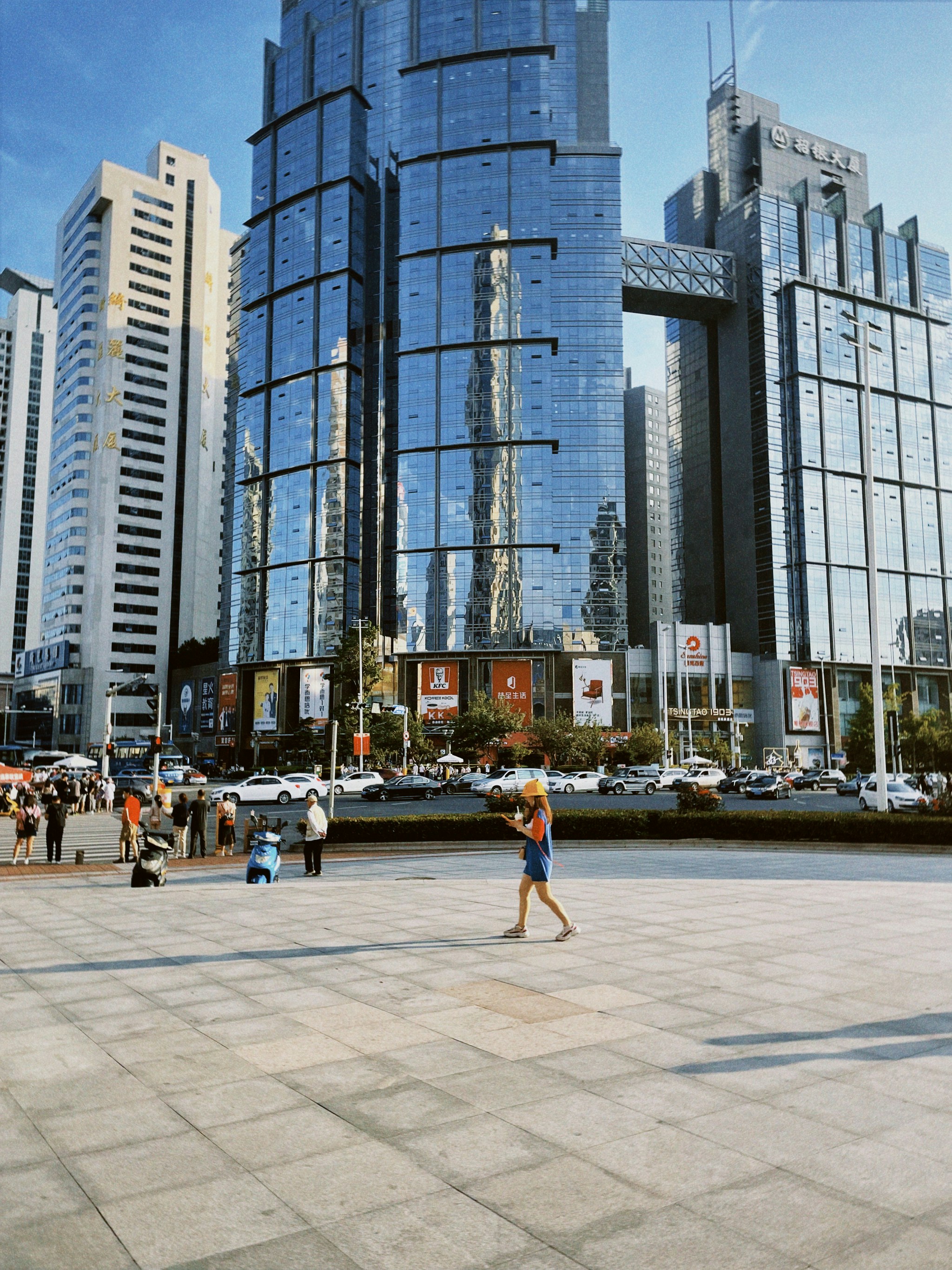 People walking on sidewalk near high rise building during daytime photo ...