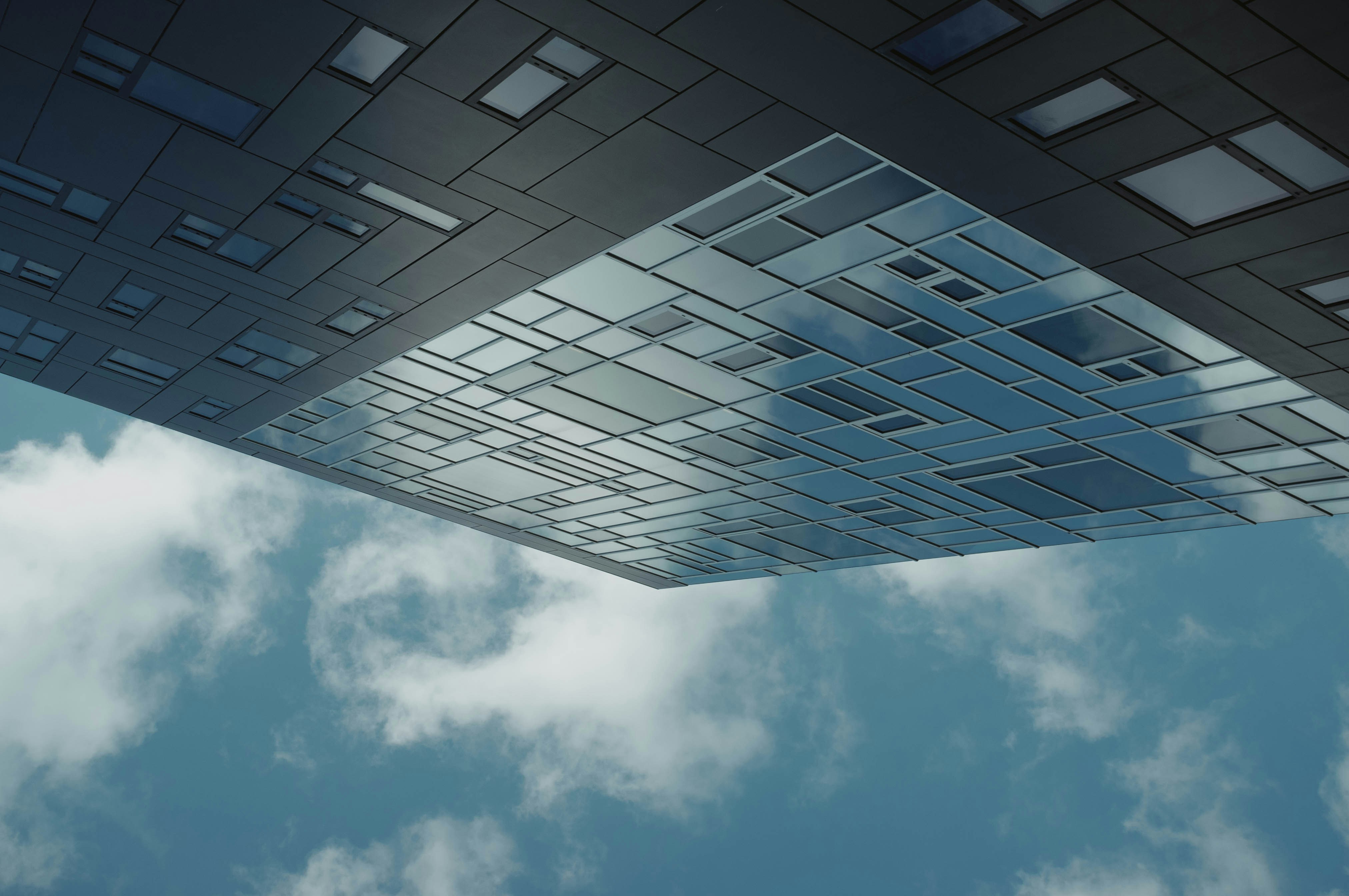 Upside-Down Facade Over a Sea of Sky