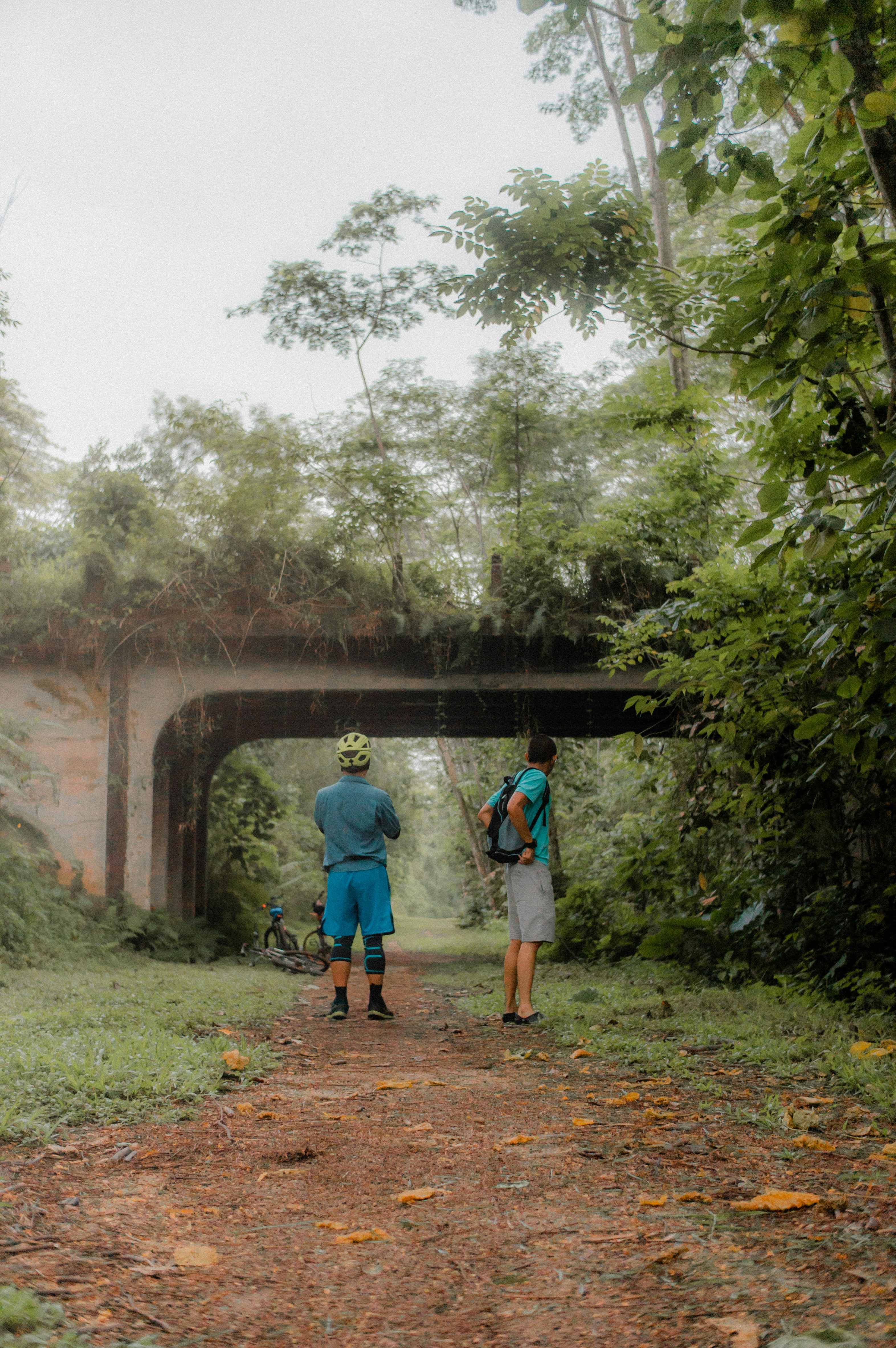 a couple of people that are standing in the dirt