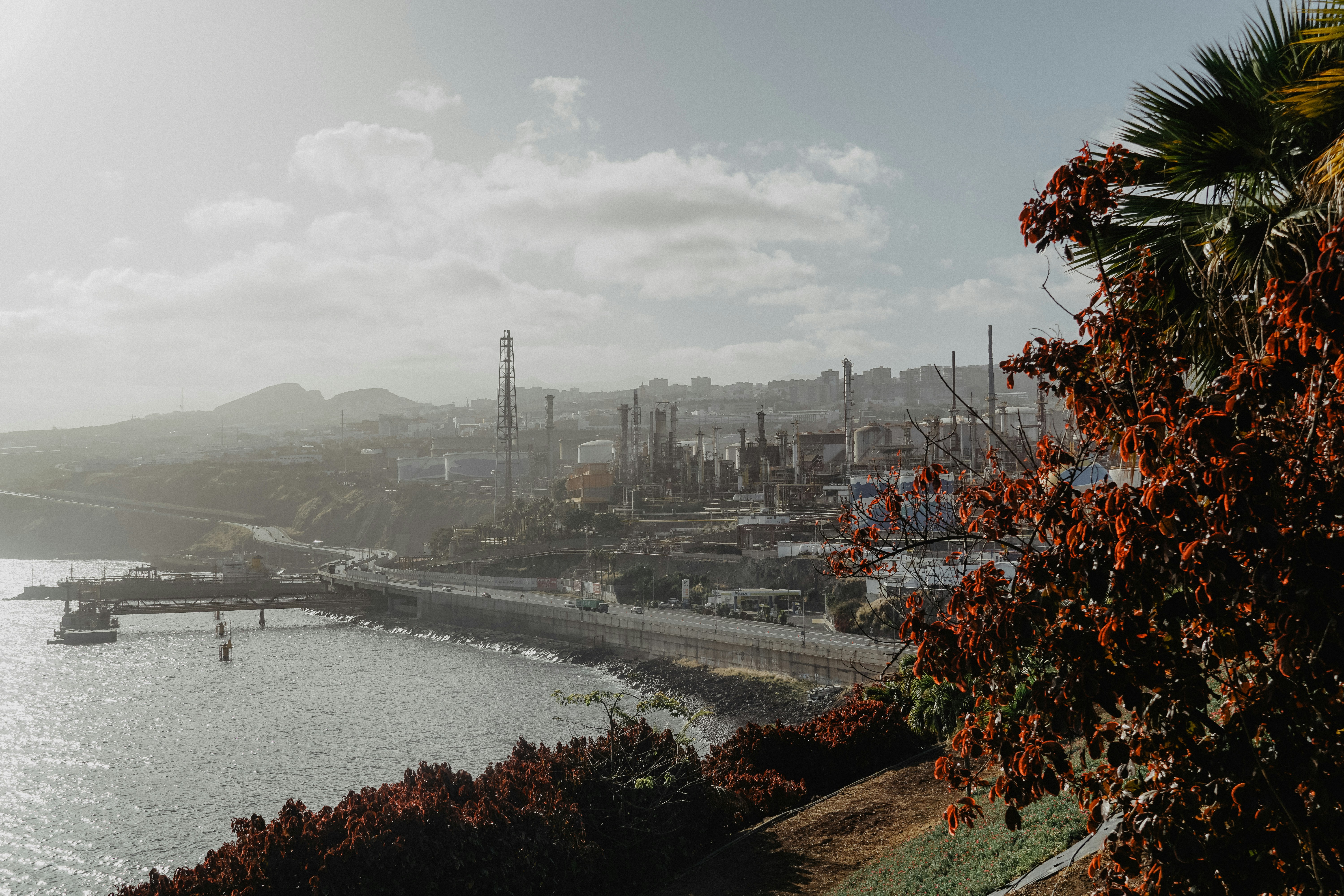 a large body of water with a city in the background