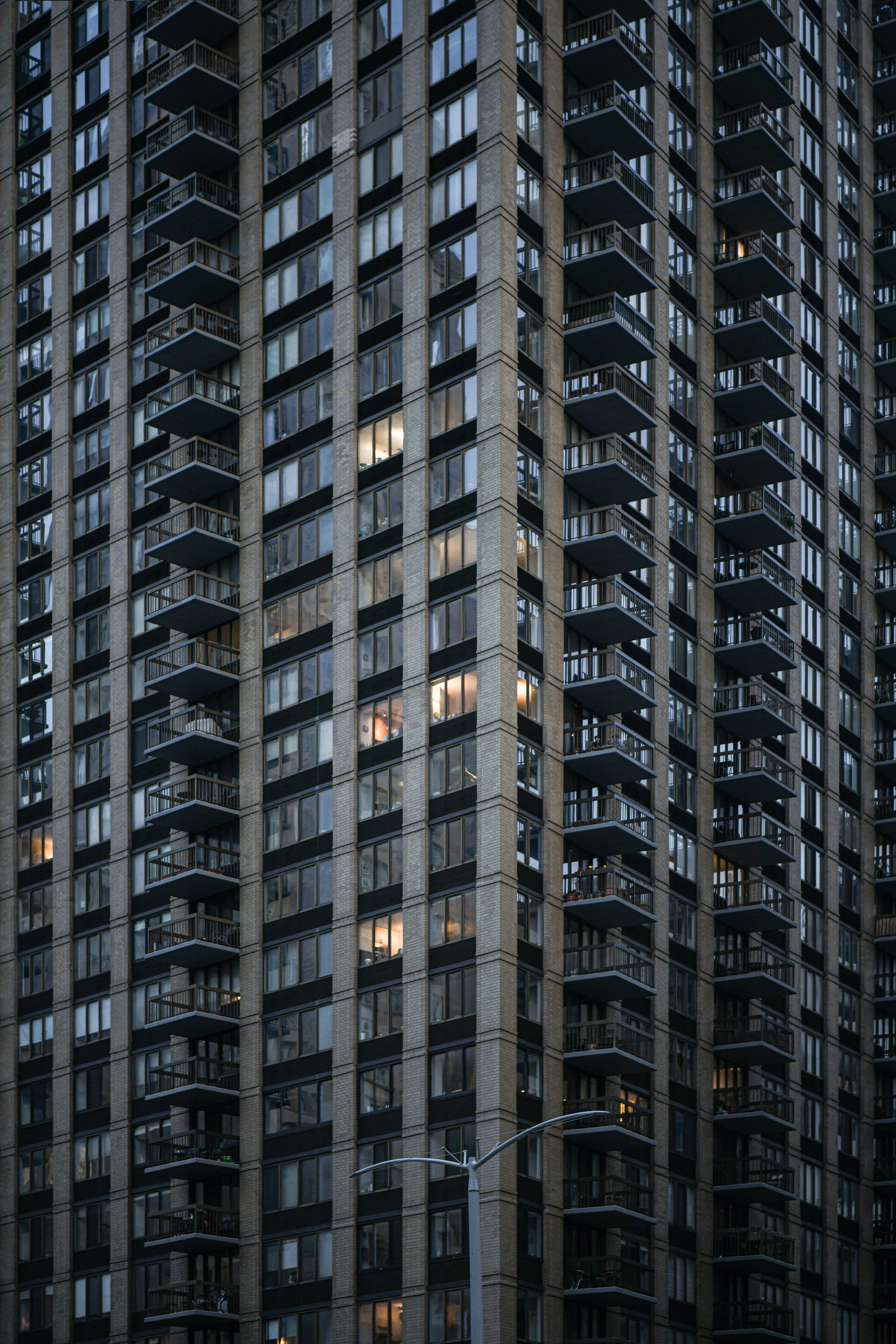 Vertical Grid: A Quiet Facade of Concrete and Glow