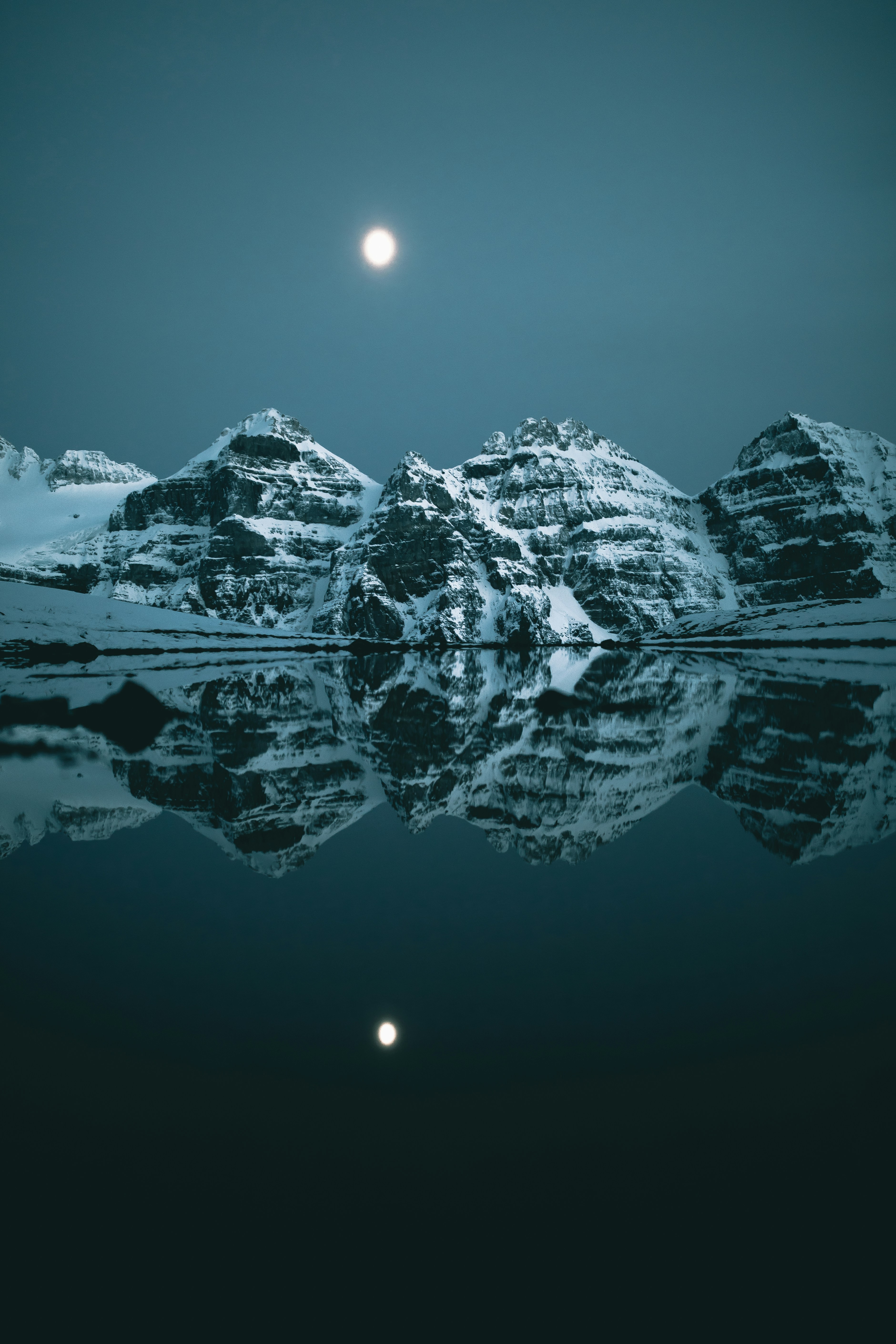 Snow covered mountain during night time photo – Free Moraine lake Image ...