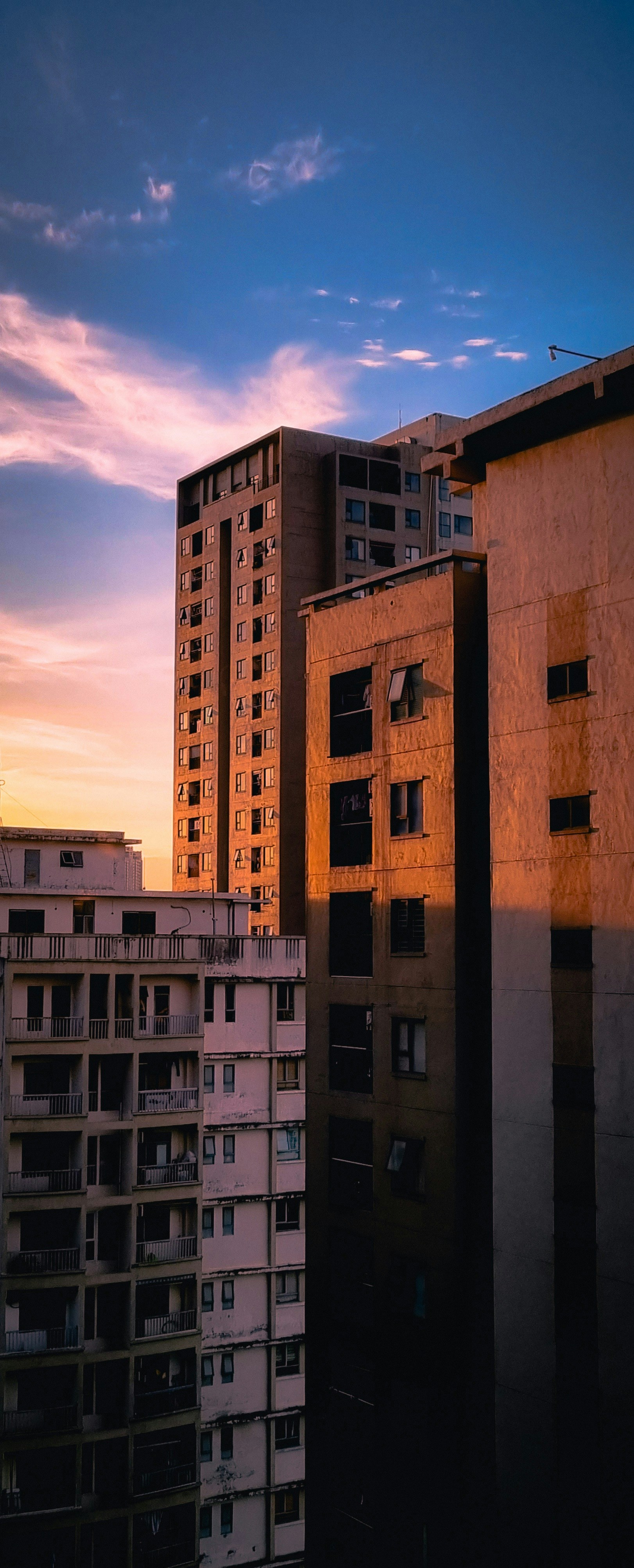 Amber Hour Towers: Sunset Light on City Facades