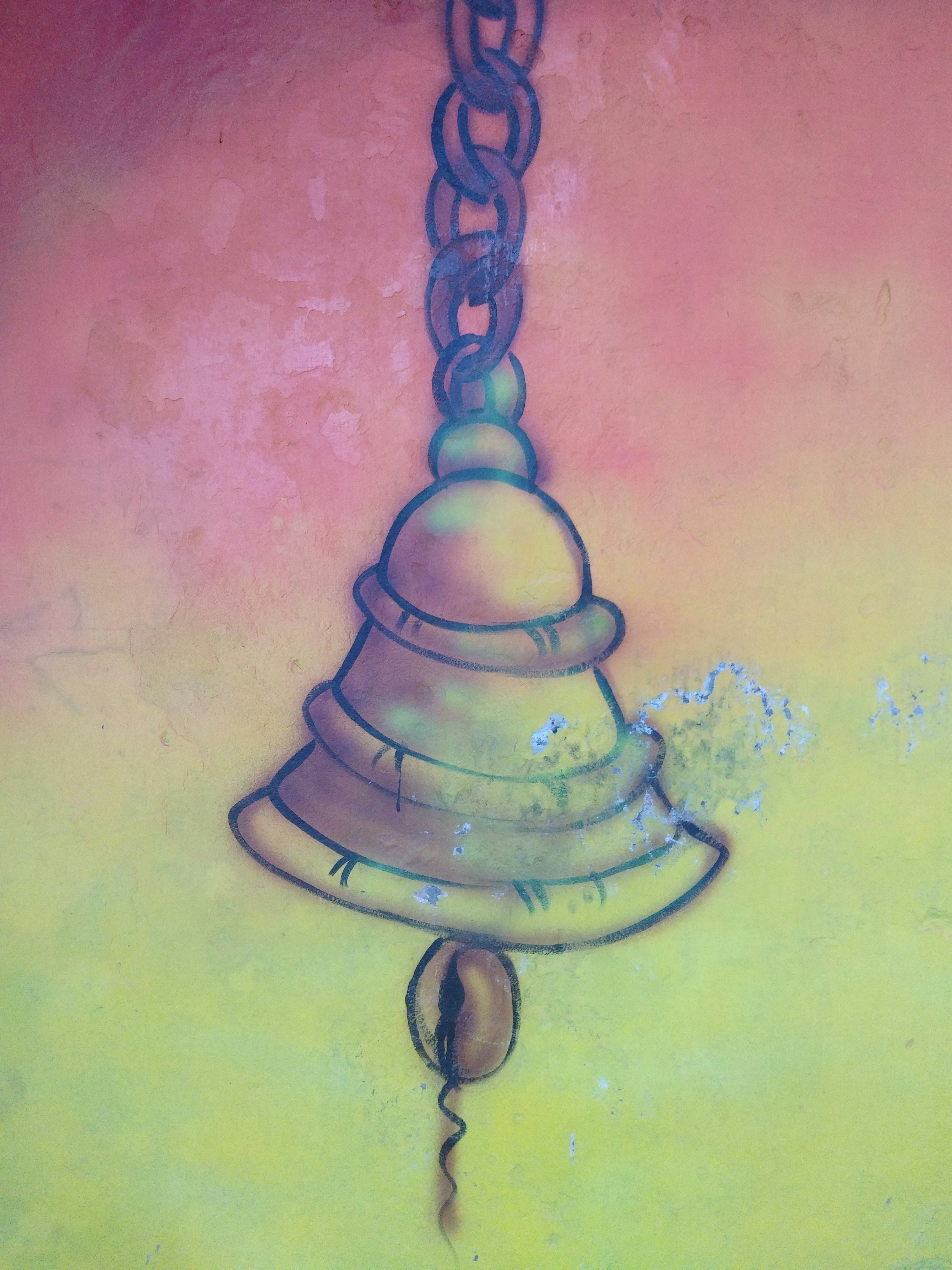 A vibrant mural depicting a bell hanging from a chain against a warm gradient background. The artwork captures the essence of cultural heritage and craftsmanship.
